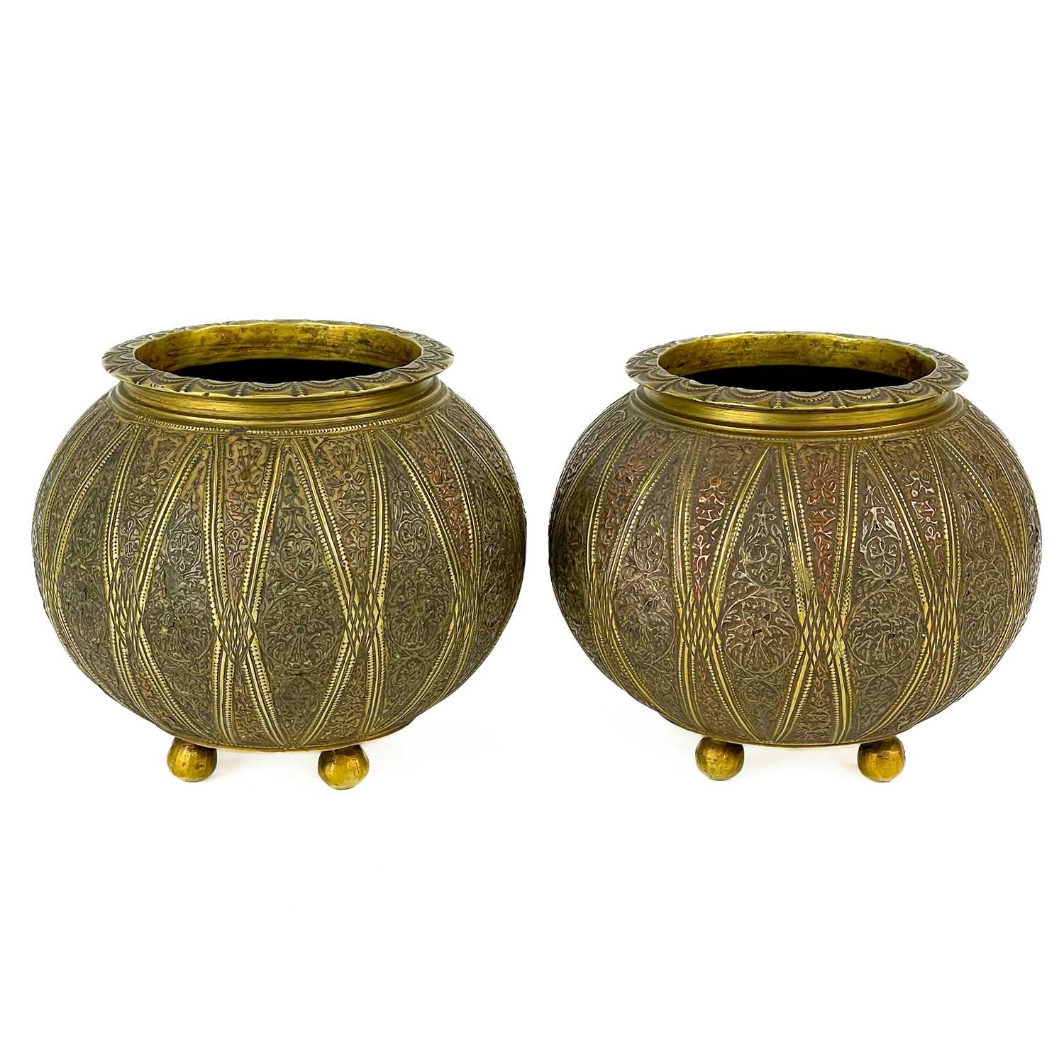 Lot 112 - A pair of Indian gilt bronze cache pots,
