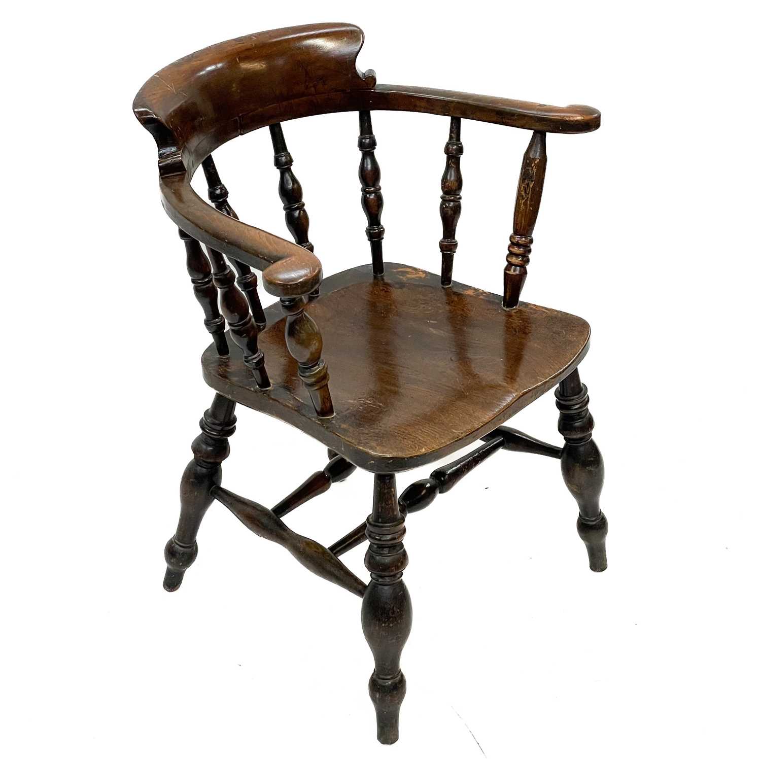 Lot 97 - A Victorian oak bow smokers chair.