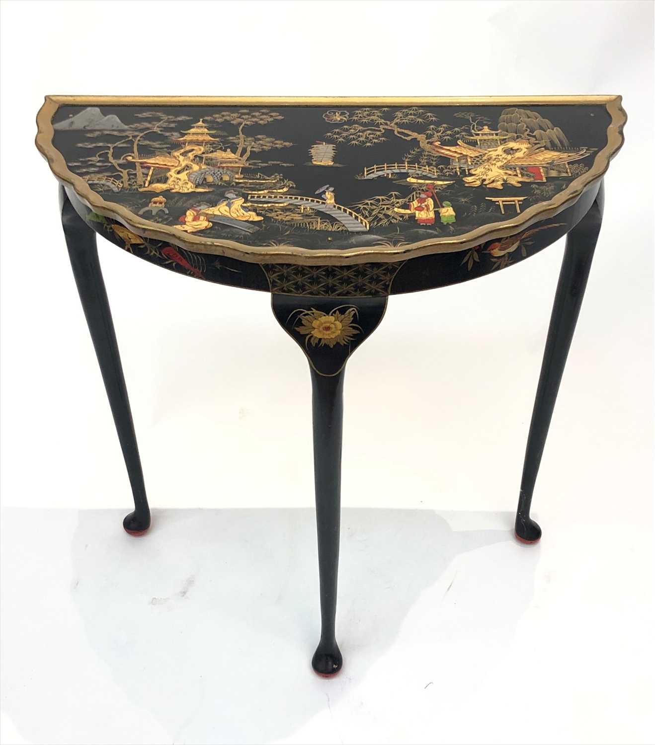 Lot 3311 - A 1930's black lacquered demi lune side