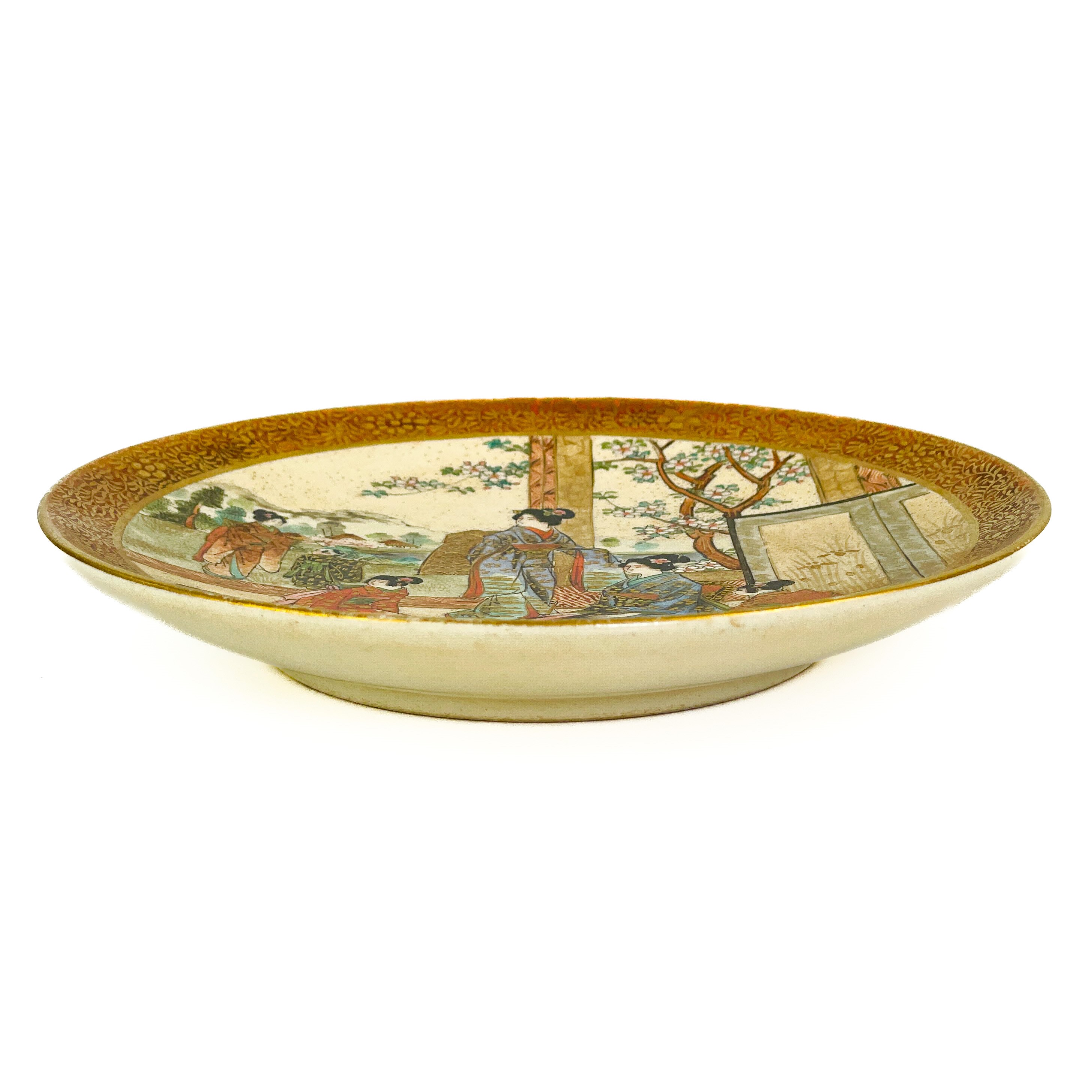 Lot 233 - A Japanese Satsuma pottery circular dish,