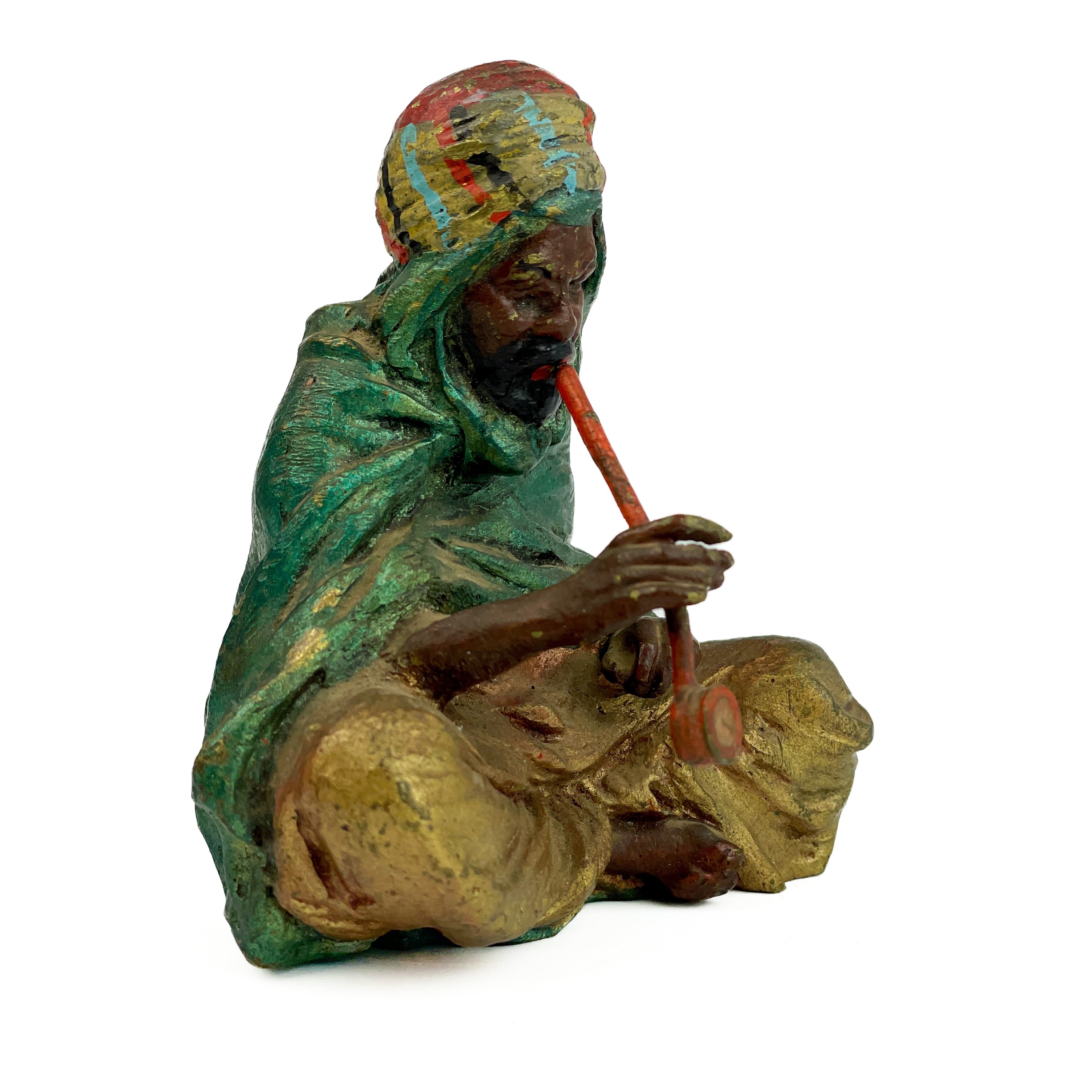 Lot 132 - A cold painted bronze model of a seated Arab