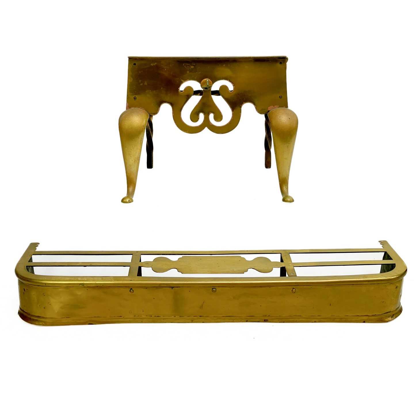 Lot 220 - A Victorian brass footman and a fender.