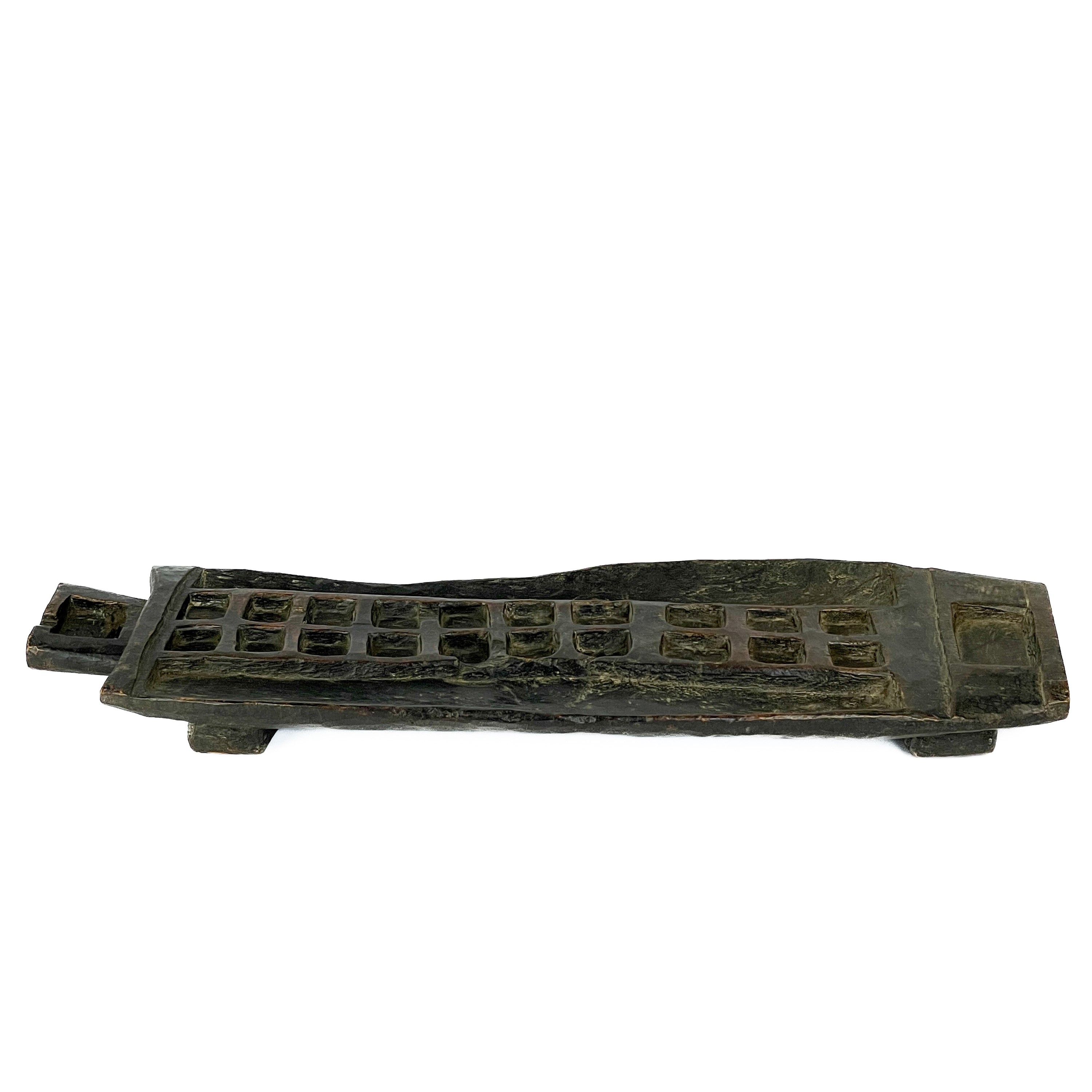 Lot 140 - An Ethiopian Gebeta game board , early 20th