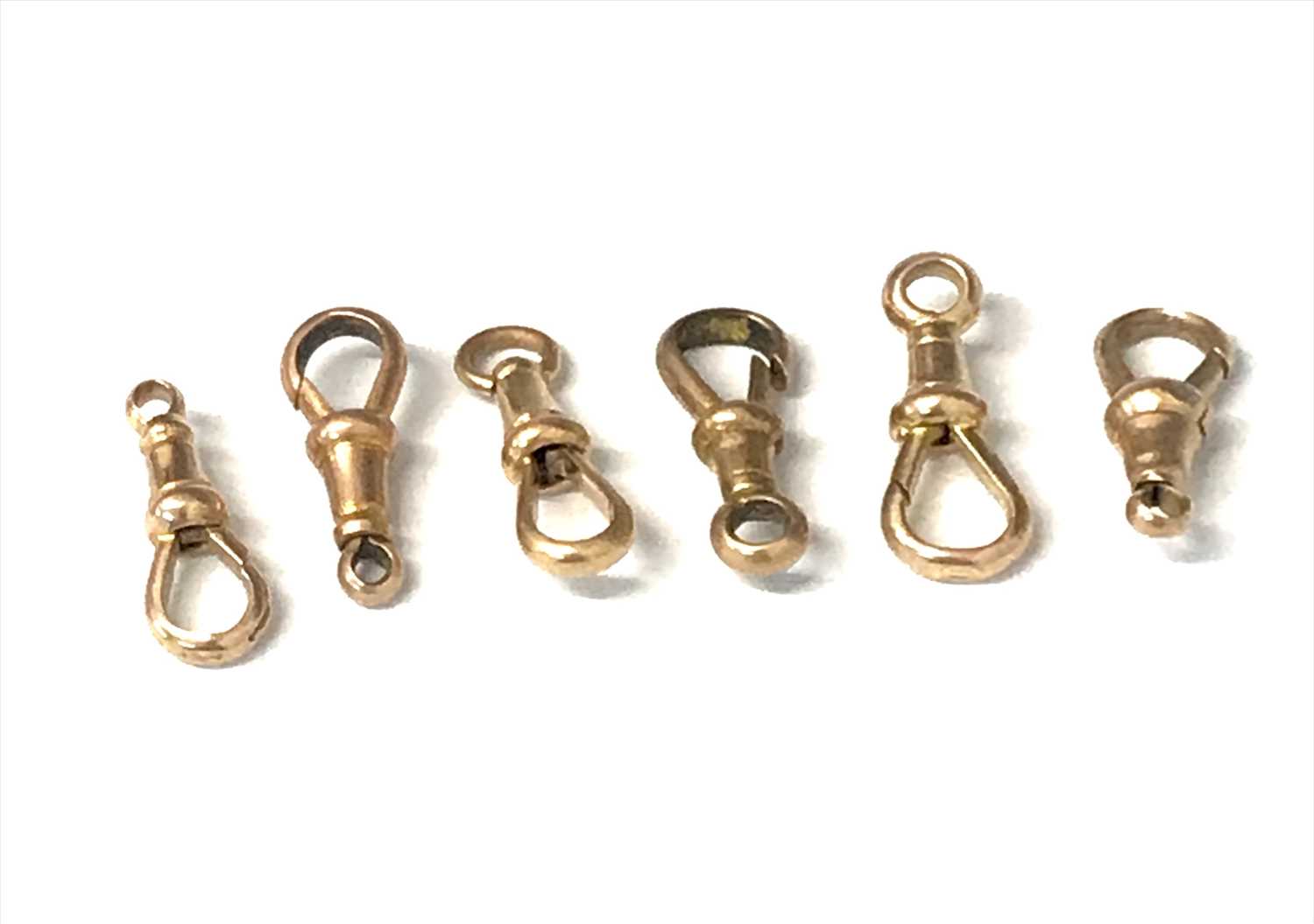 Lot 2726 - 4 x 9ct gold swivel clips, 7.1gm together