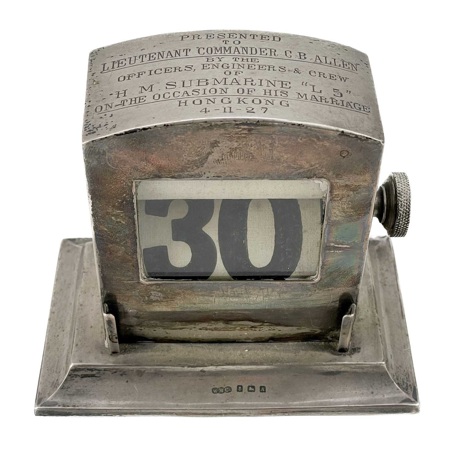 Lot 293 - A silver perpetual desk calendar, presented