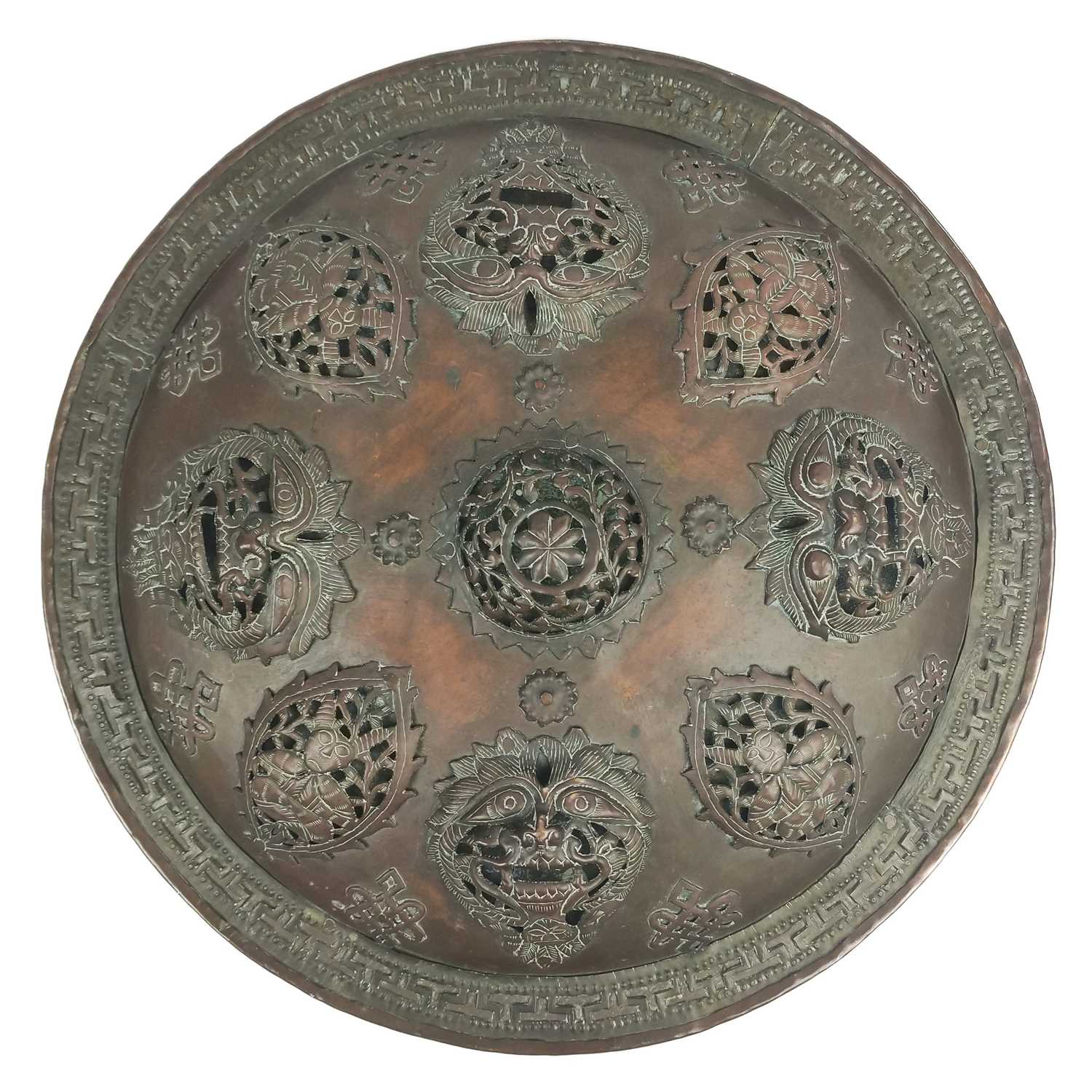 Lot 1118 - A Tibetan ceremonial copper shield, late