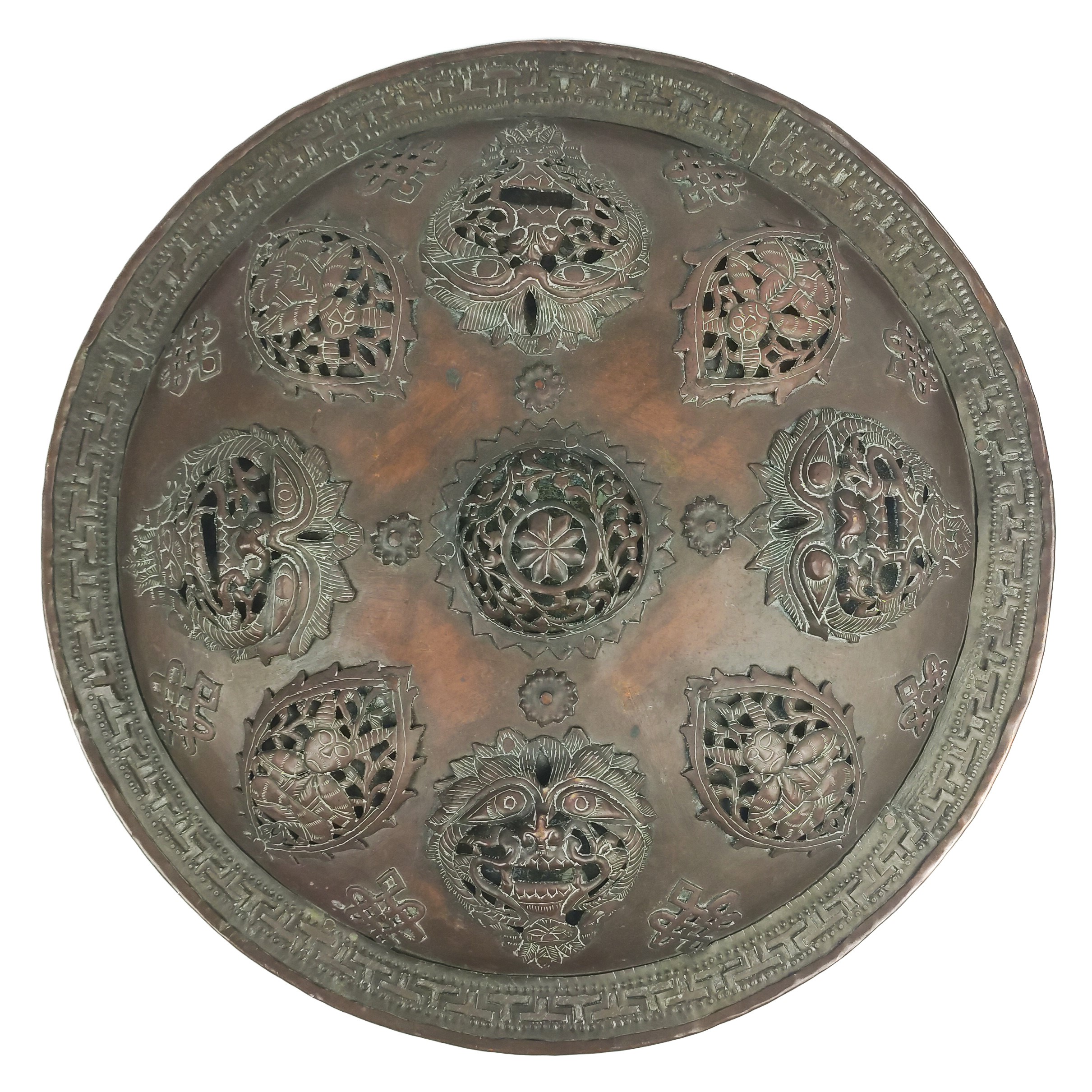 Lot 1118 - A Tibetan ceremonial copper shield, late