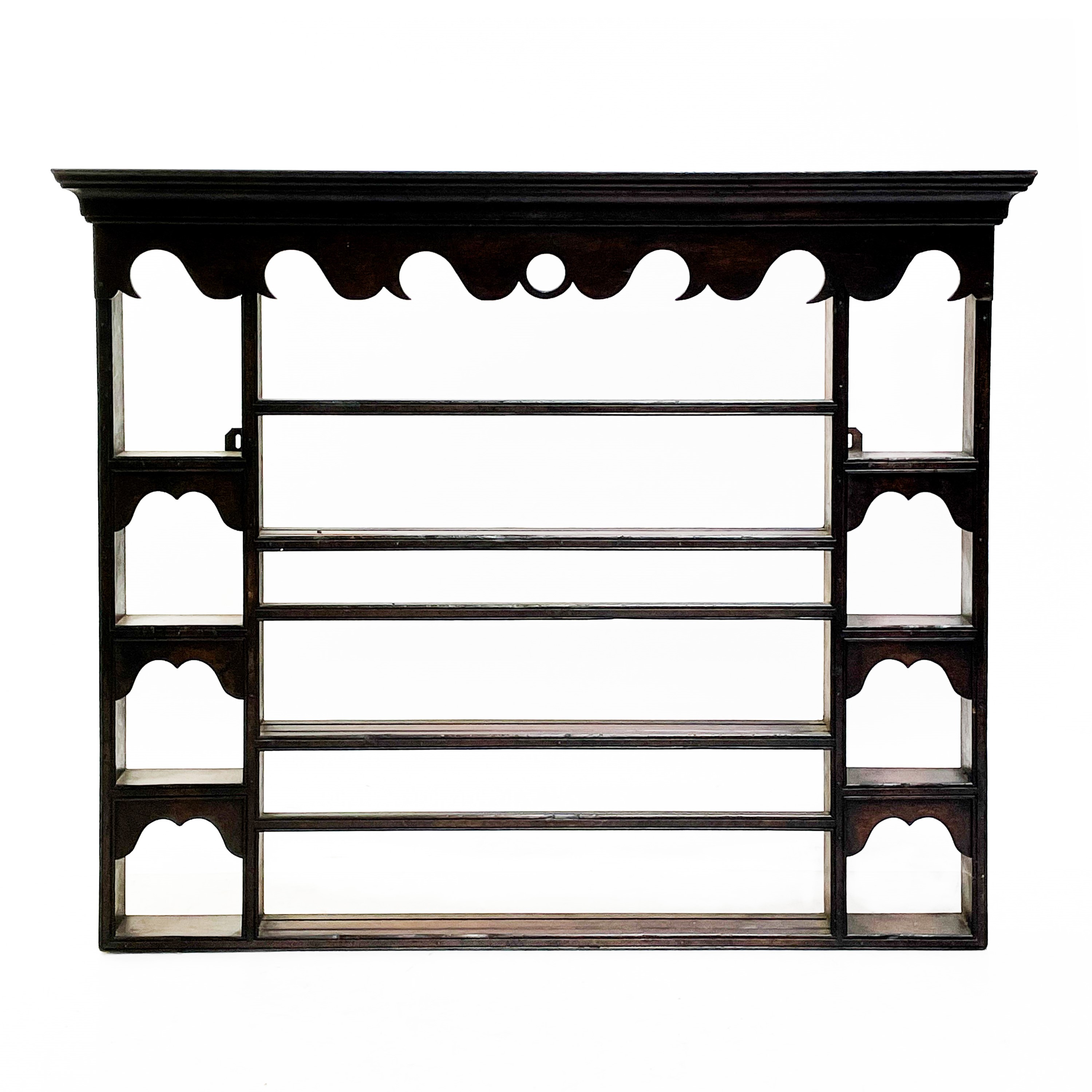 Lot 234 - An oak delft rack.