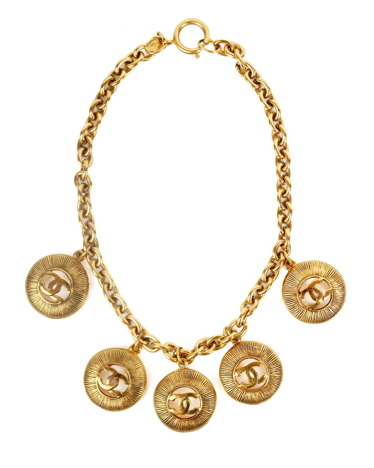 Lot 459 - A Chanel 24ct gold-plated CC medallion
