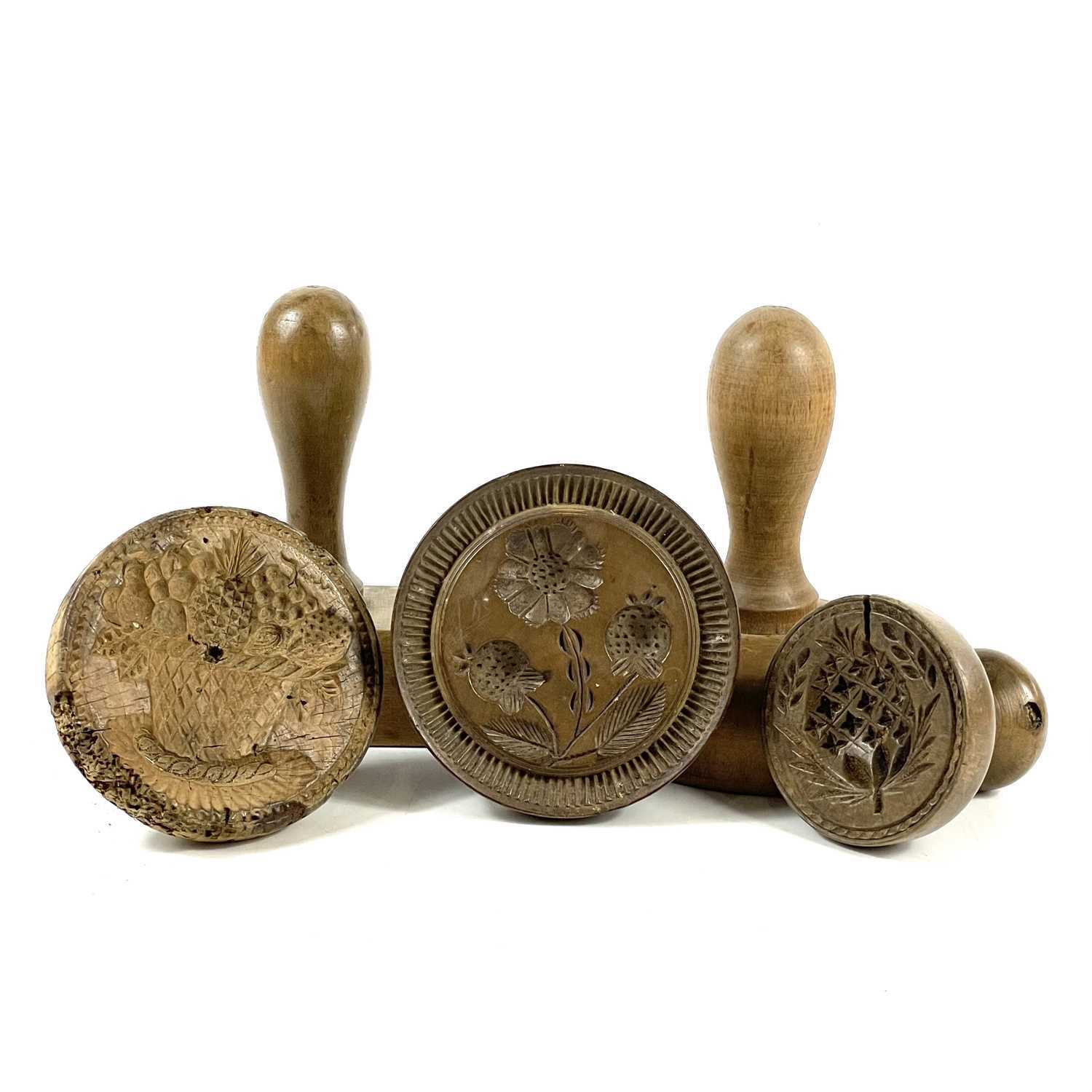 Lot 126 - Five treen butter stamps.