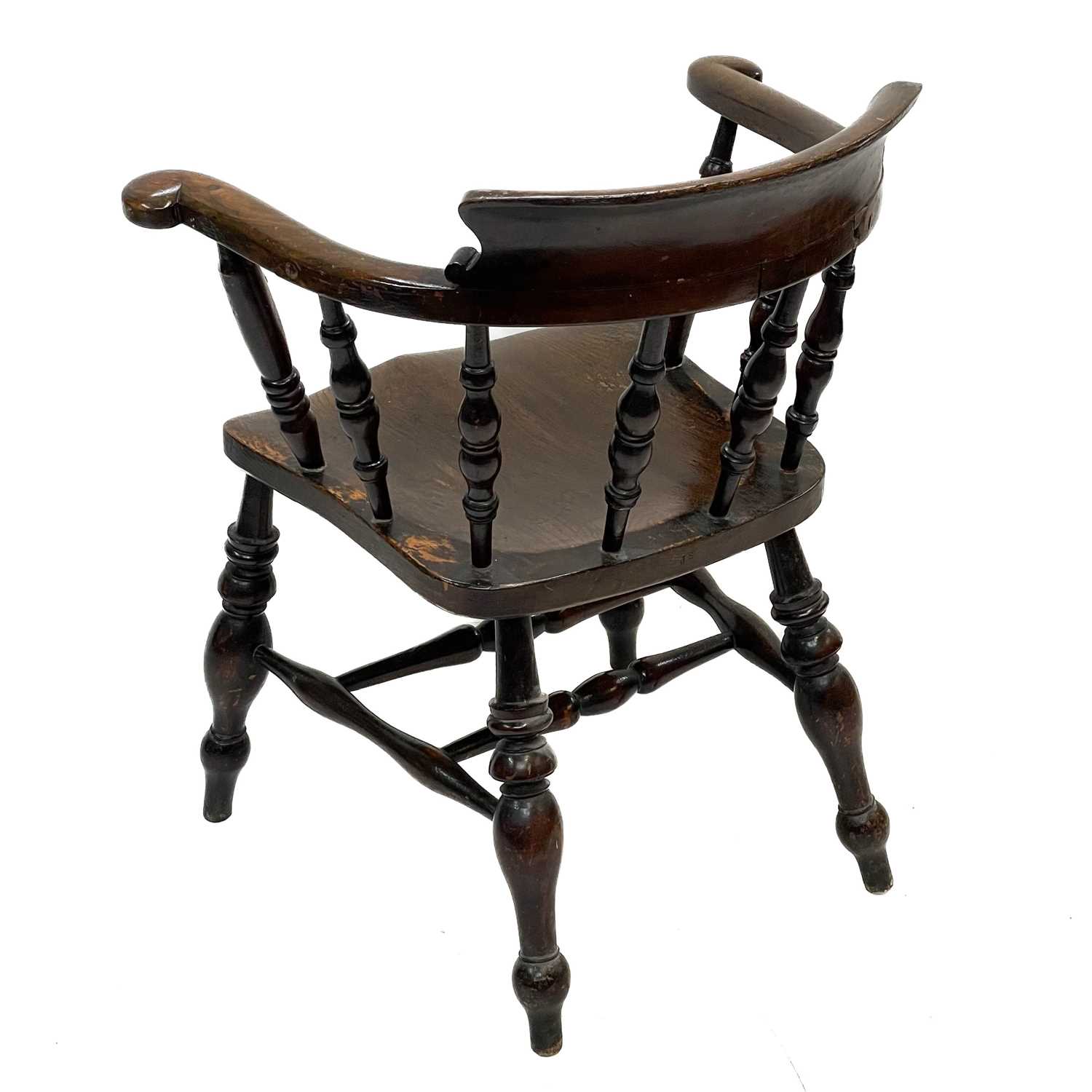 Lot 170 - A Victorian oak bow smokers chair.