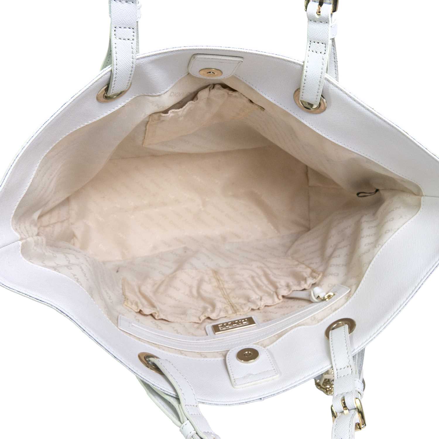 Lot 545 - A DKNY white embossed leather handbag.