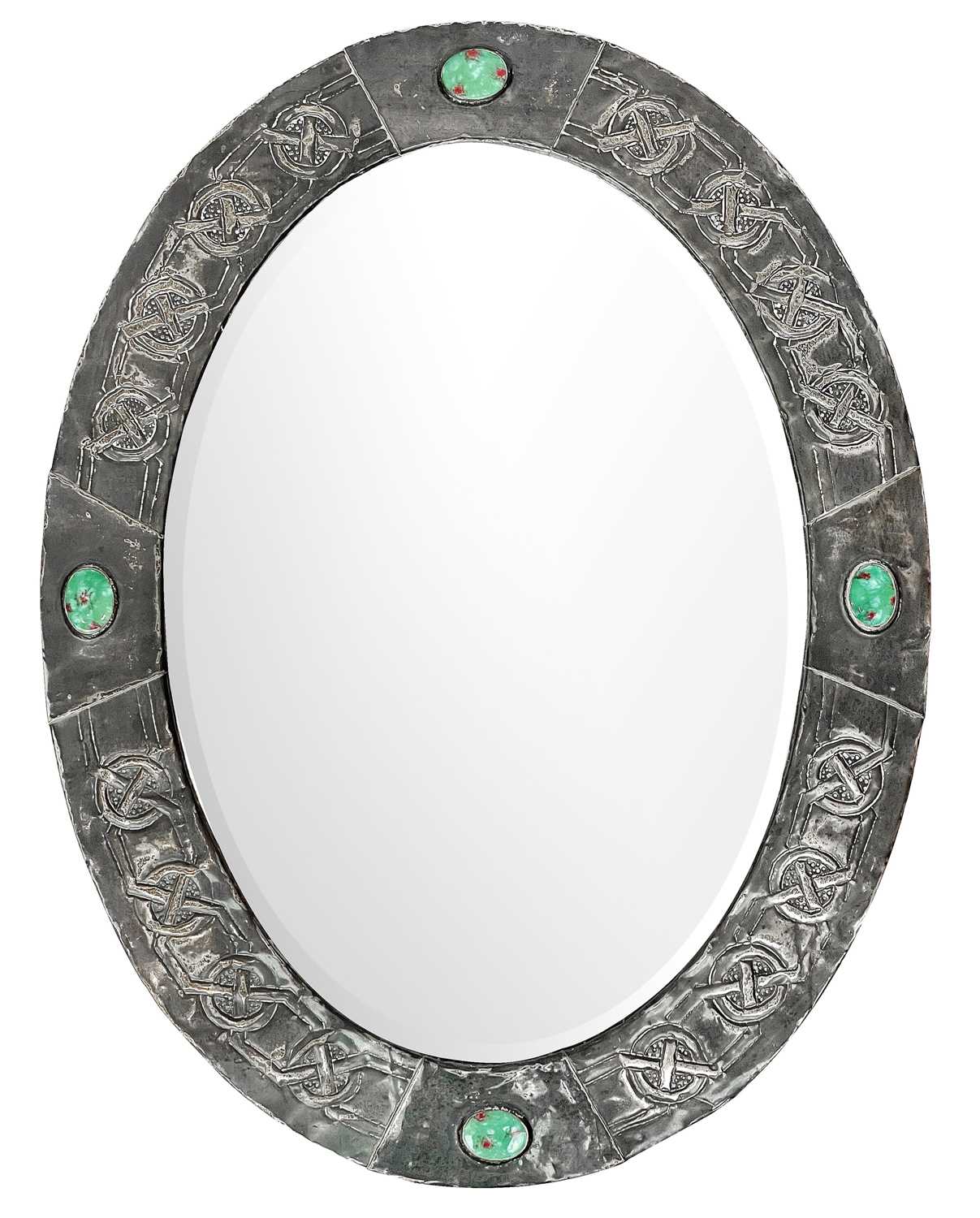 Lot 10 - An Arts and Crafts oval pewter mirror.