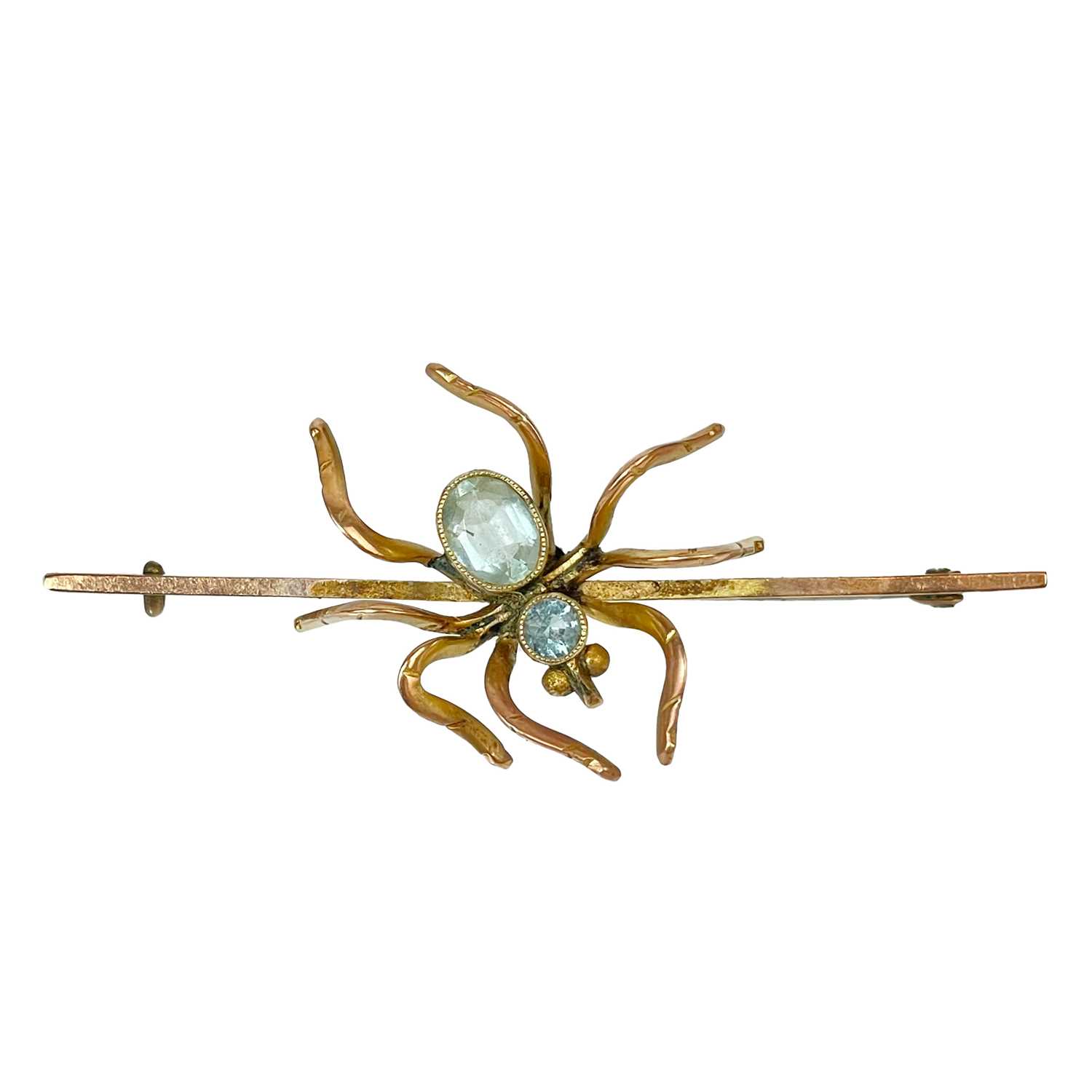 Lot 72 - A 9ct gold pale blue stone set spider bar