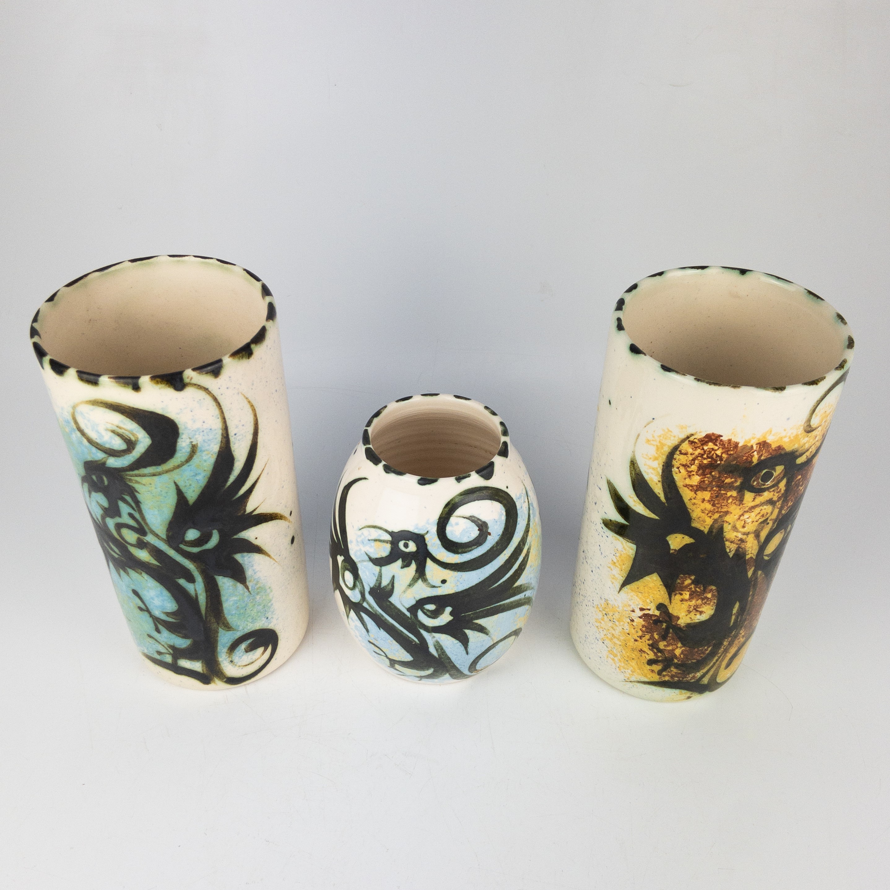 Lot 442 - Two Celtic Newlyn pottery cylindrical vases.