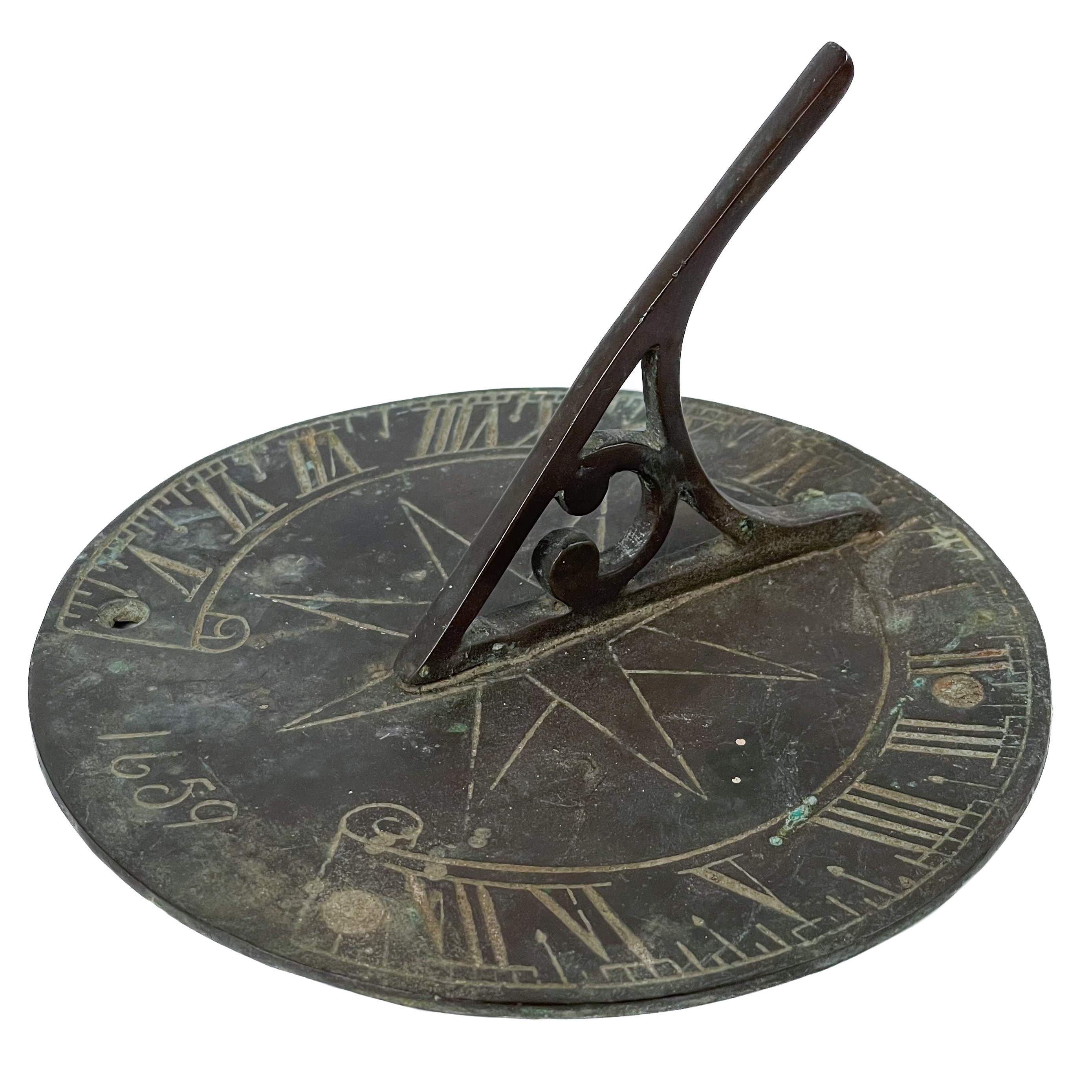 Lot 135 - A bronze circular sundial with gnomon and