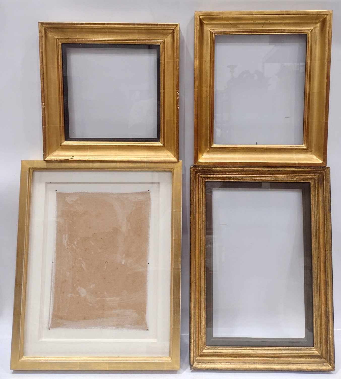 Lot 299 - Four glazed gilt picture frames of composite