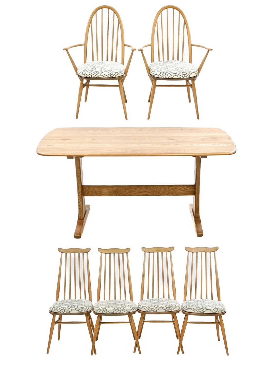 Lot 744 - An Ercol light elm and beech dining table