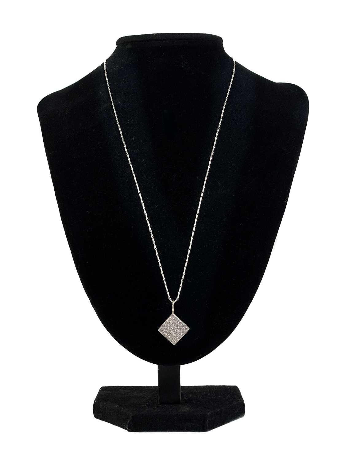 Lot 160 - An 18ct white gold diamond set lozenge shape