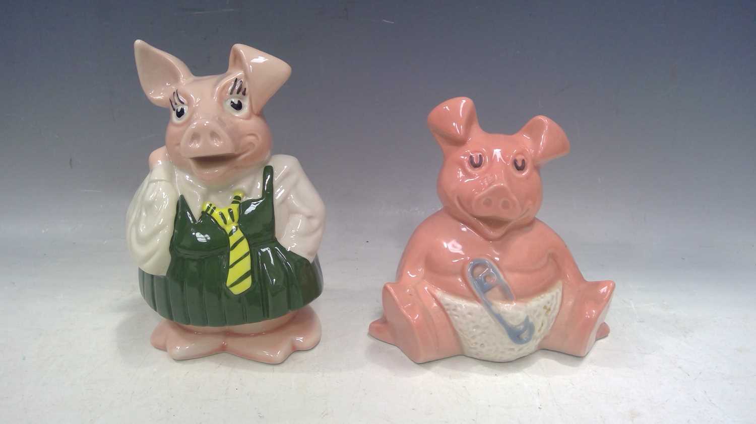 Lot 68 - Two Wade, Natwest Pigs. The Larger Pig stands