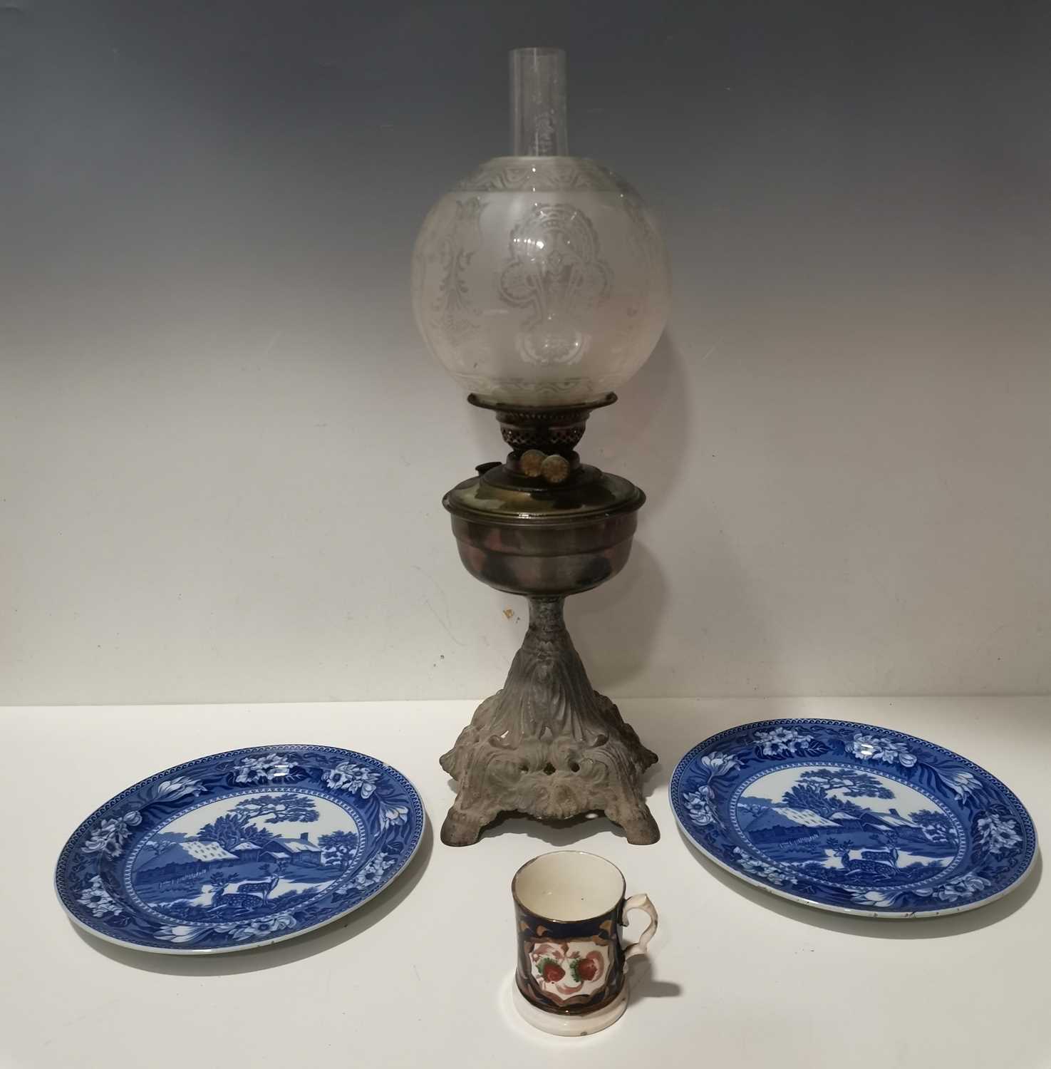 Lot 74 - A Victorian oil lamp with markings to the