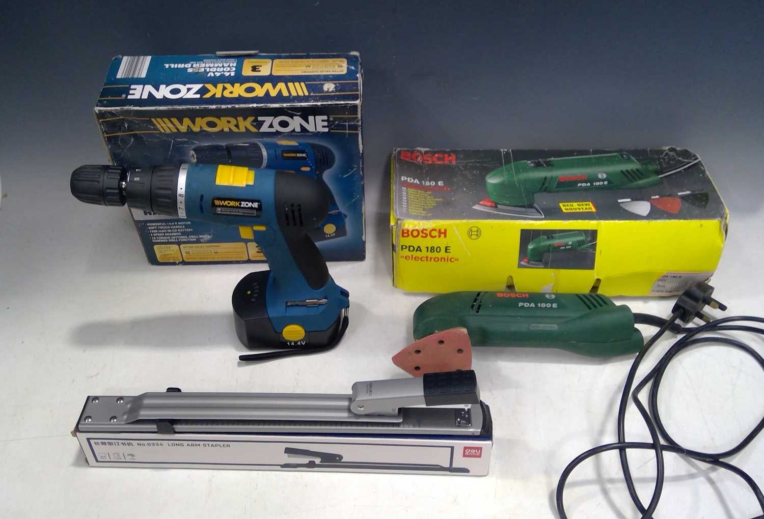 Lot 86 - A Bosch Delta Sander, a Workzone Battery