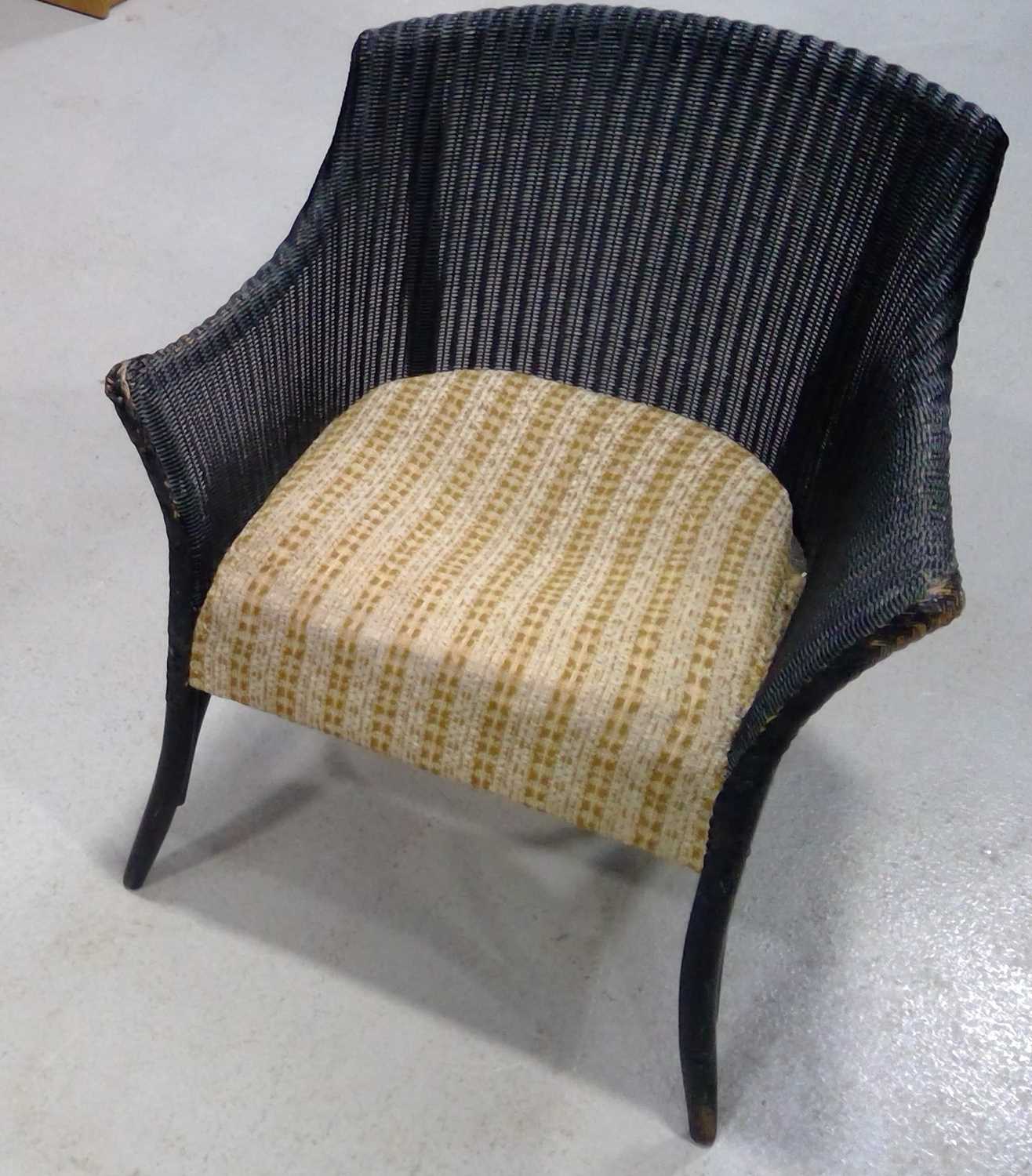 Lot 21 - A Lloyd Loom chair. 68cm tall by 62cm wide.