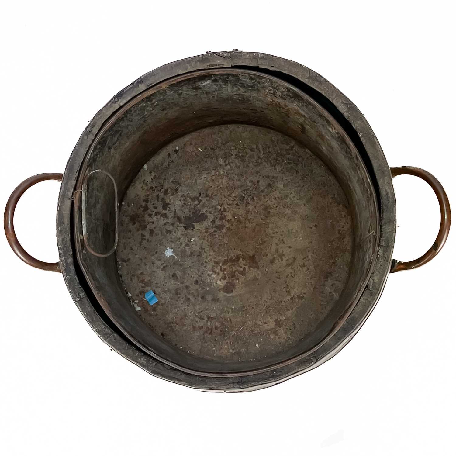 Lot 50 - A copper bound oak barrel form log bin.