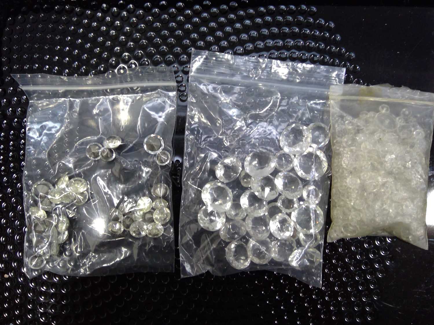 Lot 78 - A collection of clear paste 'gems'. Varying