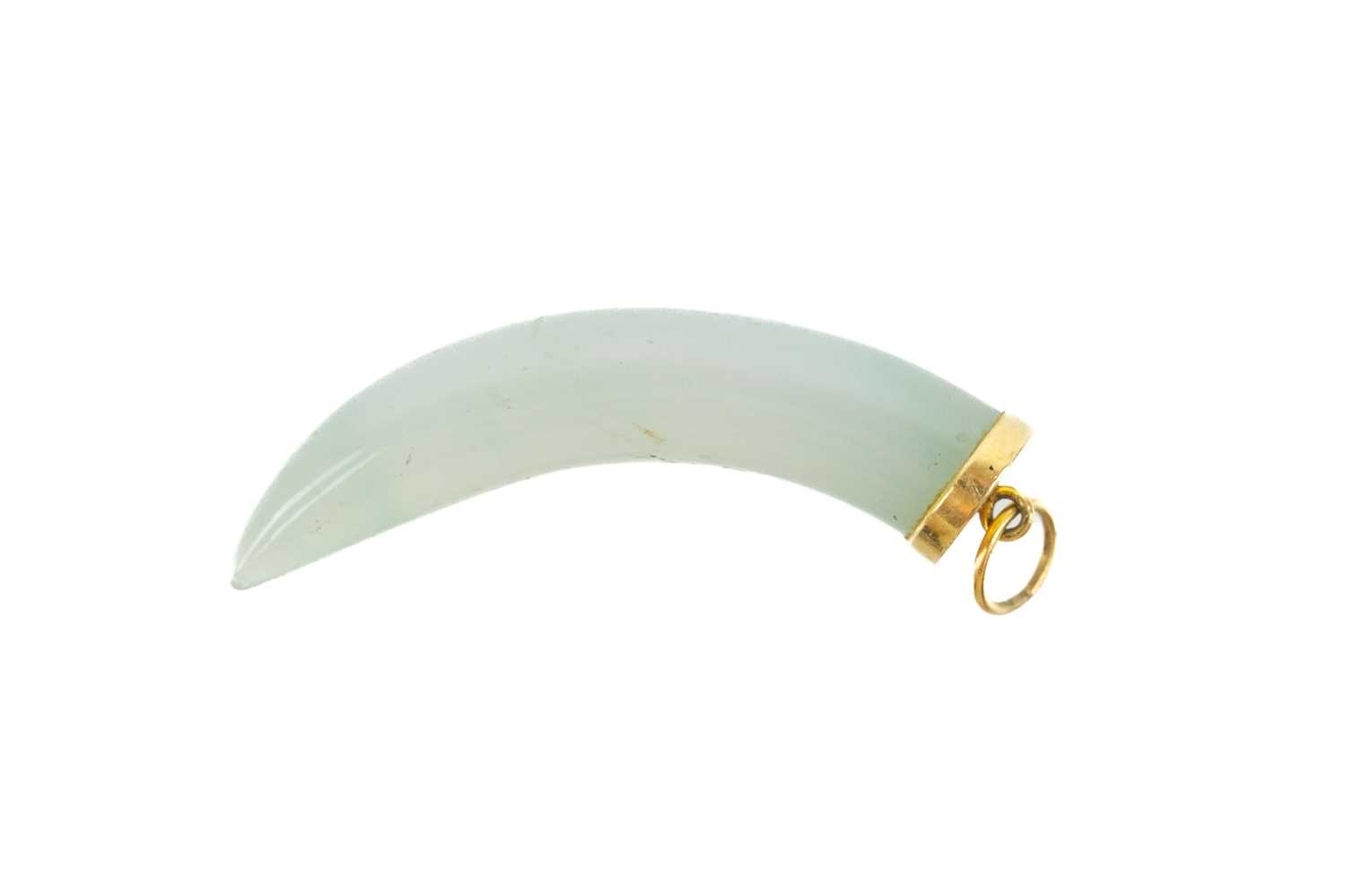 Lot 239 - A 14ct mounted pale celadon jade tusk design