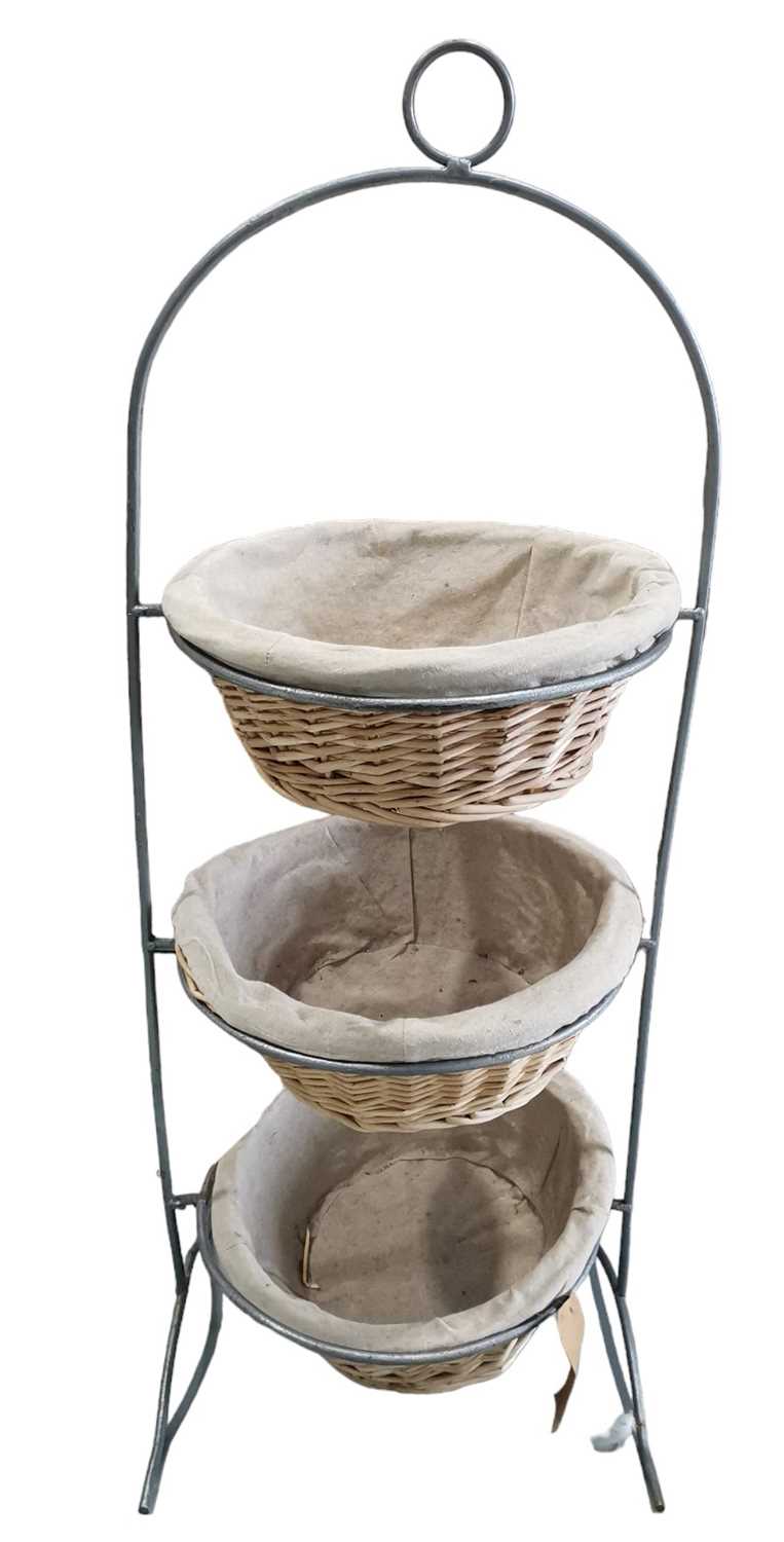 Lot 62 - A three-tier wrought iron and wicker basket