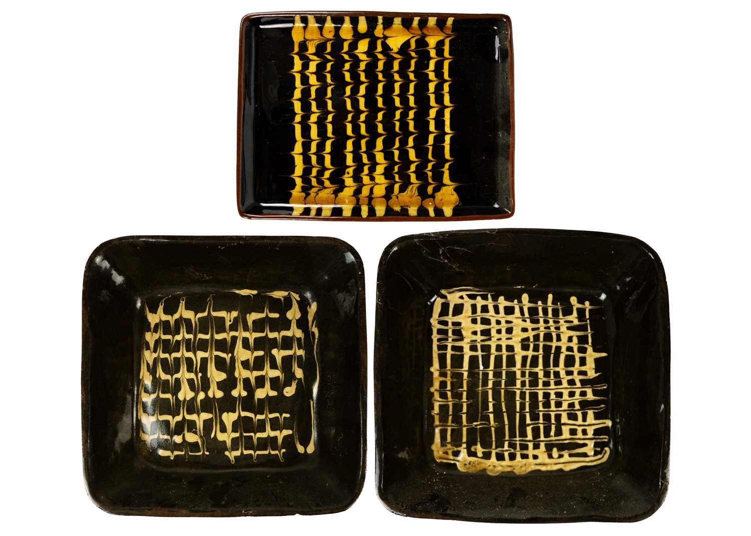 Lot 1269 - Three slipware pottery dishes.