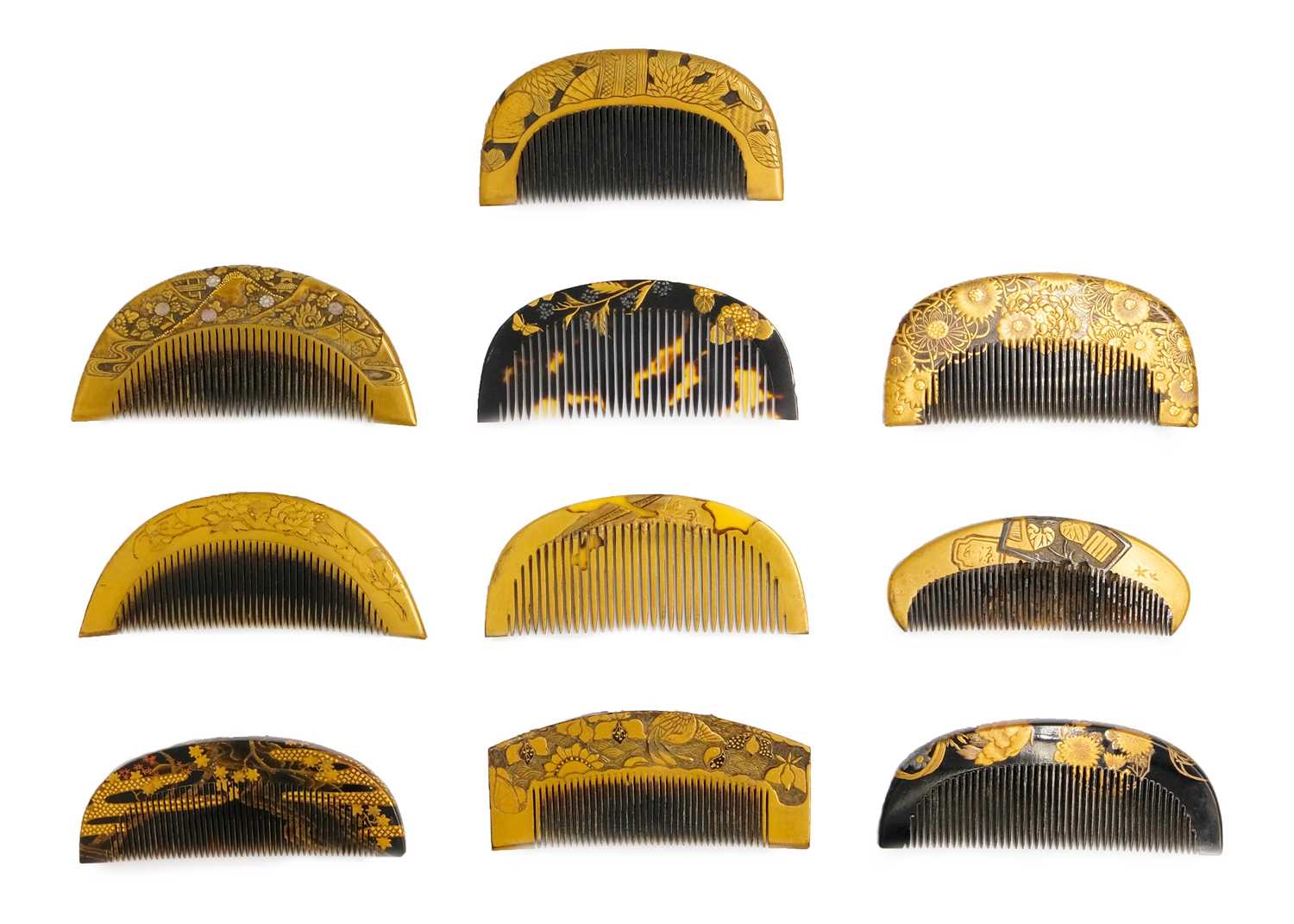 Lot 414 - A Japanese gold lacquer decorated comb,