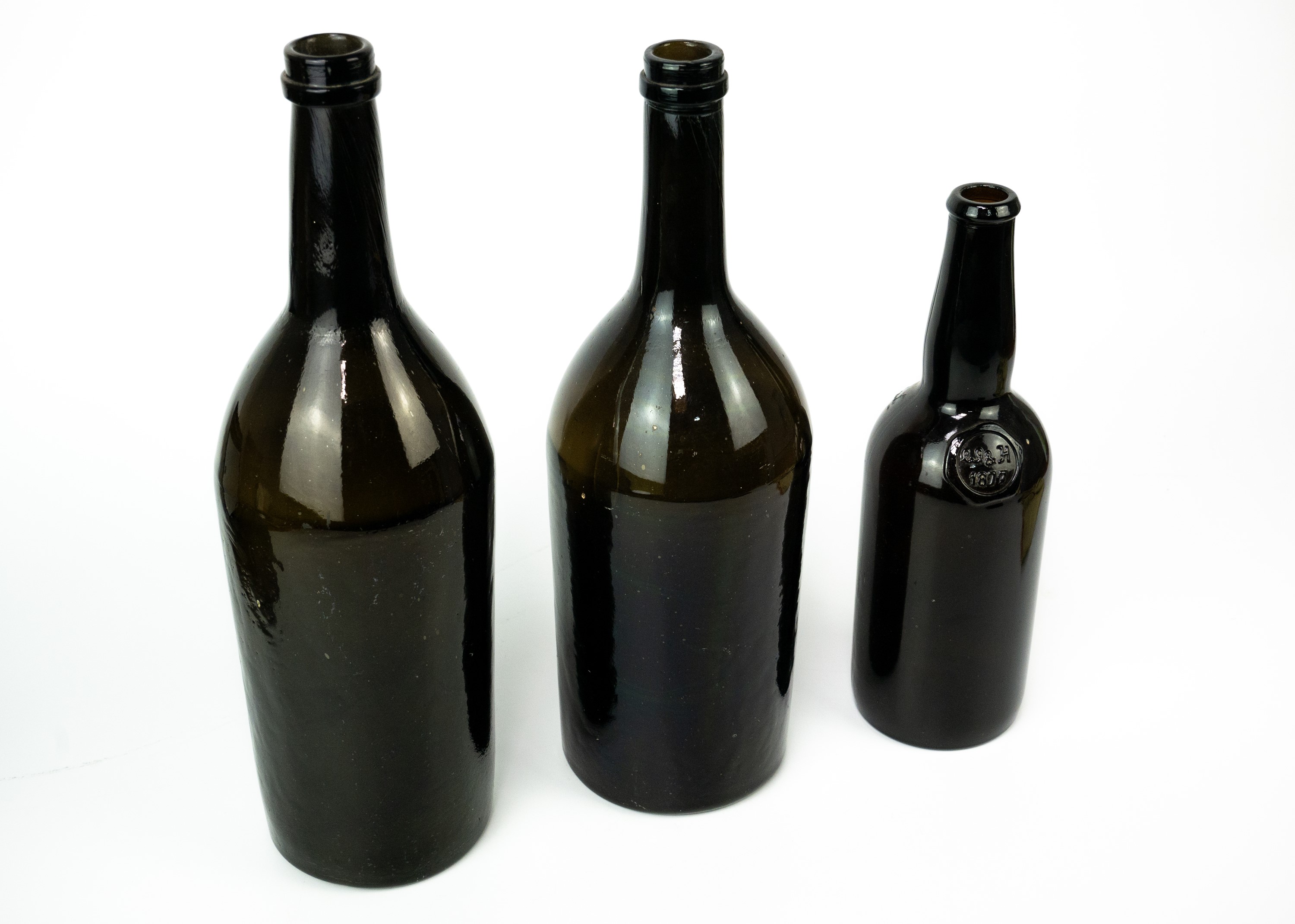 Lot 411 - A green glass magnum wine bottle, circa 1820.