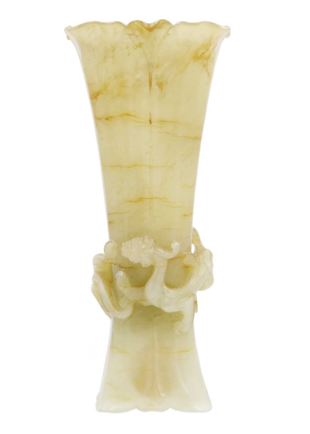 Lot 84 - A Chinese pale green jade Gu vase, early Qing