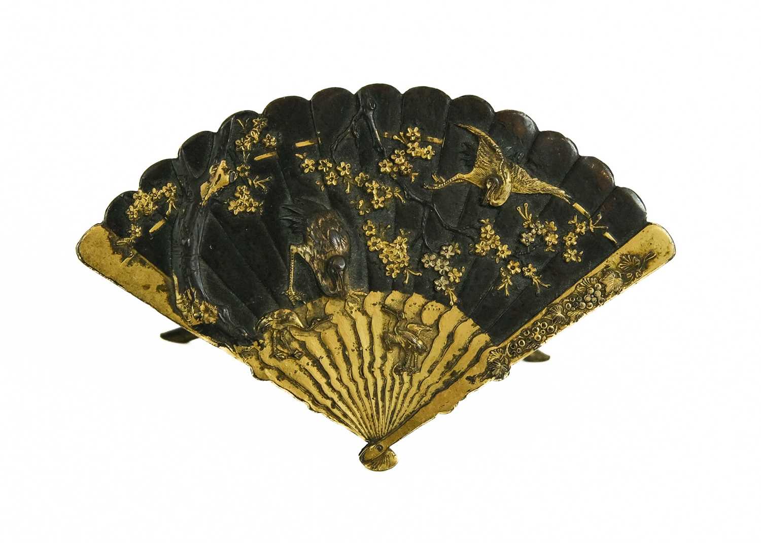 Lot 548 - A Japanese Shakudo mixed alloy fan shaped