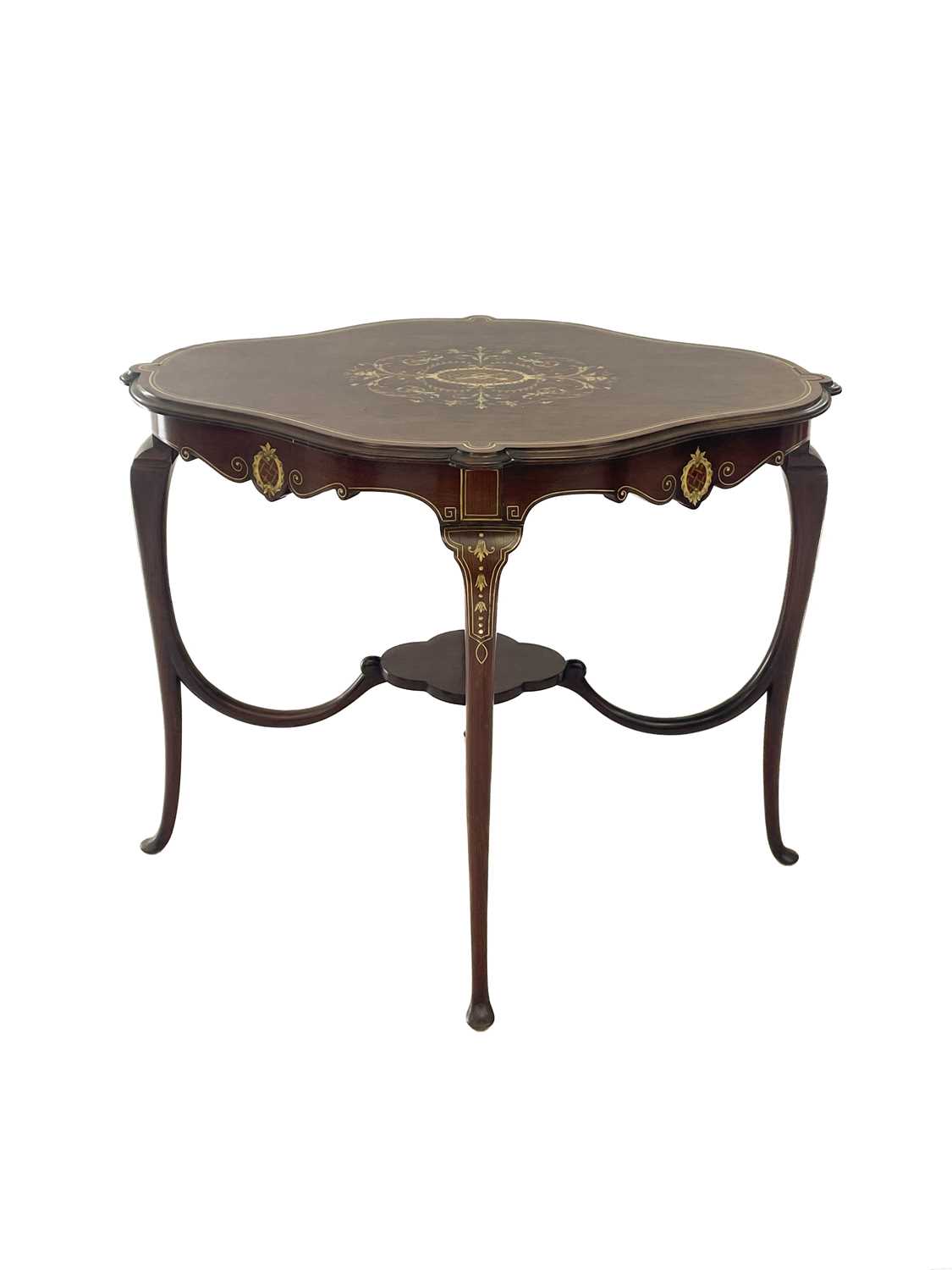 Lot 596 - A mid century Italian walnut quatrefoil