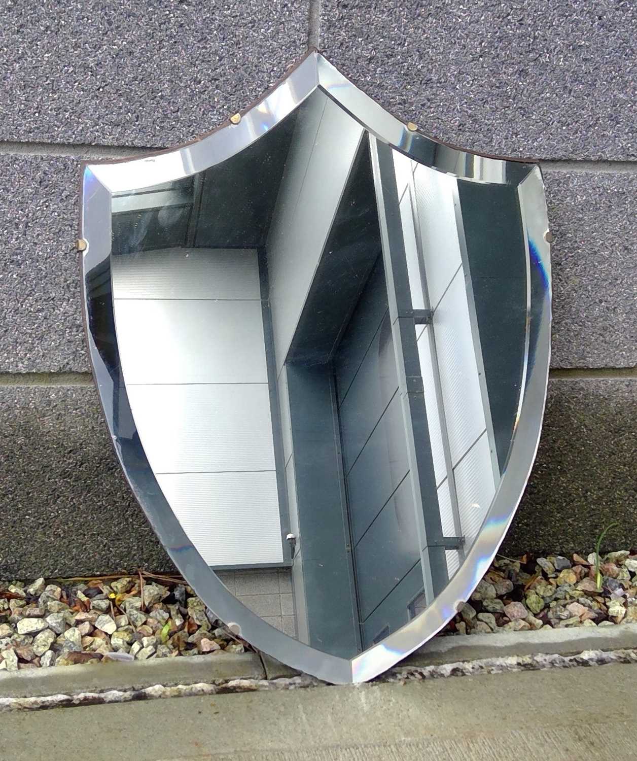 Lot 137 - A Bevelled Edge Shield-Shaped Mirror. 61cm x