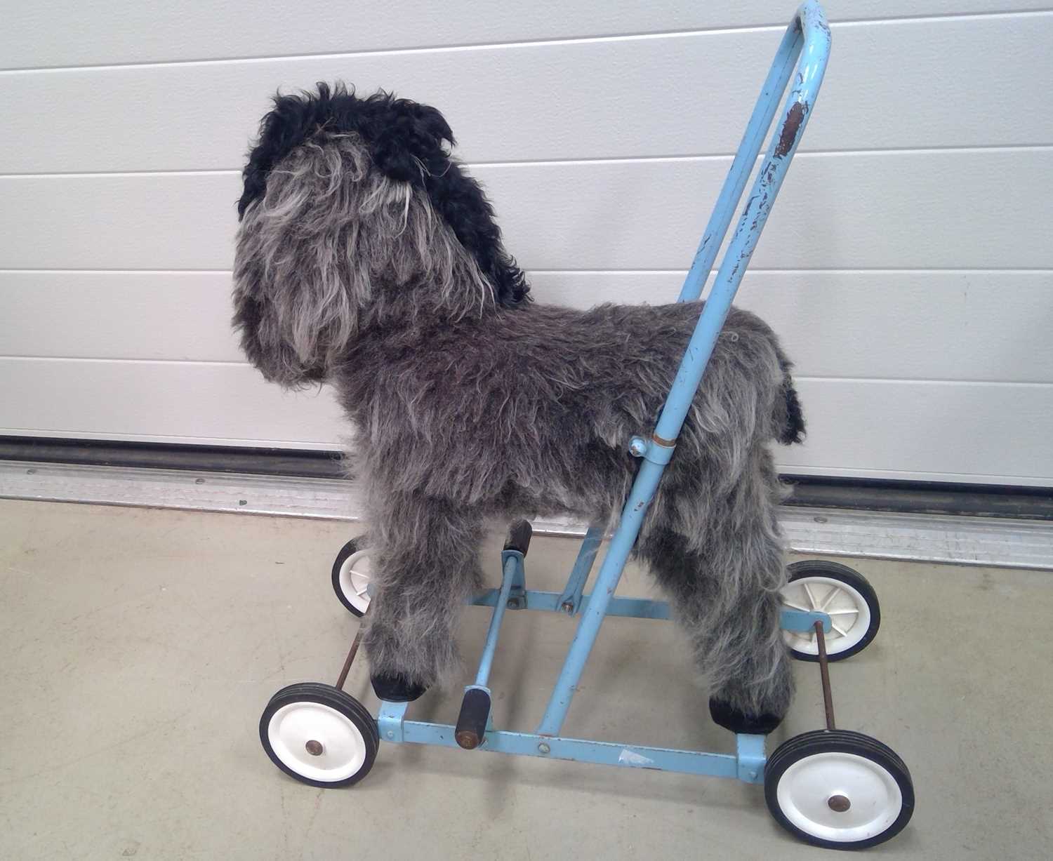 Lot 230 - A Vintage Merrythought Push Along Donkey.