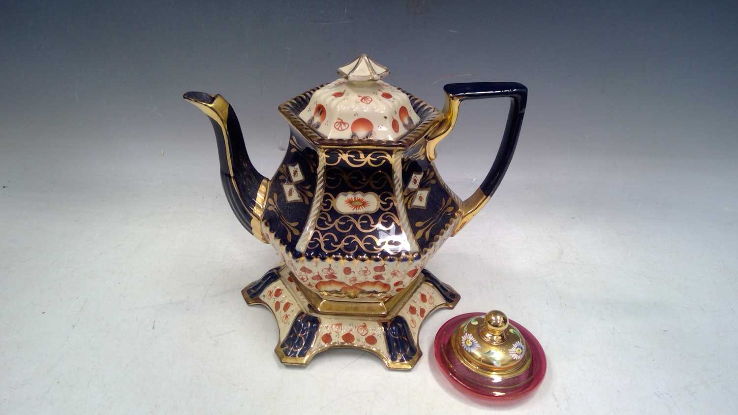 Lot 293 - An Ironstone Teapot and Stand.