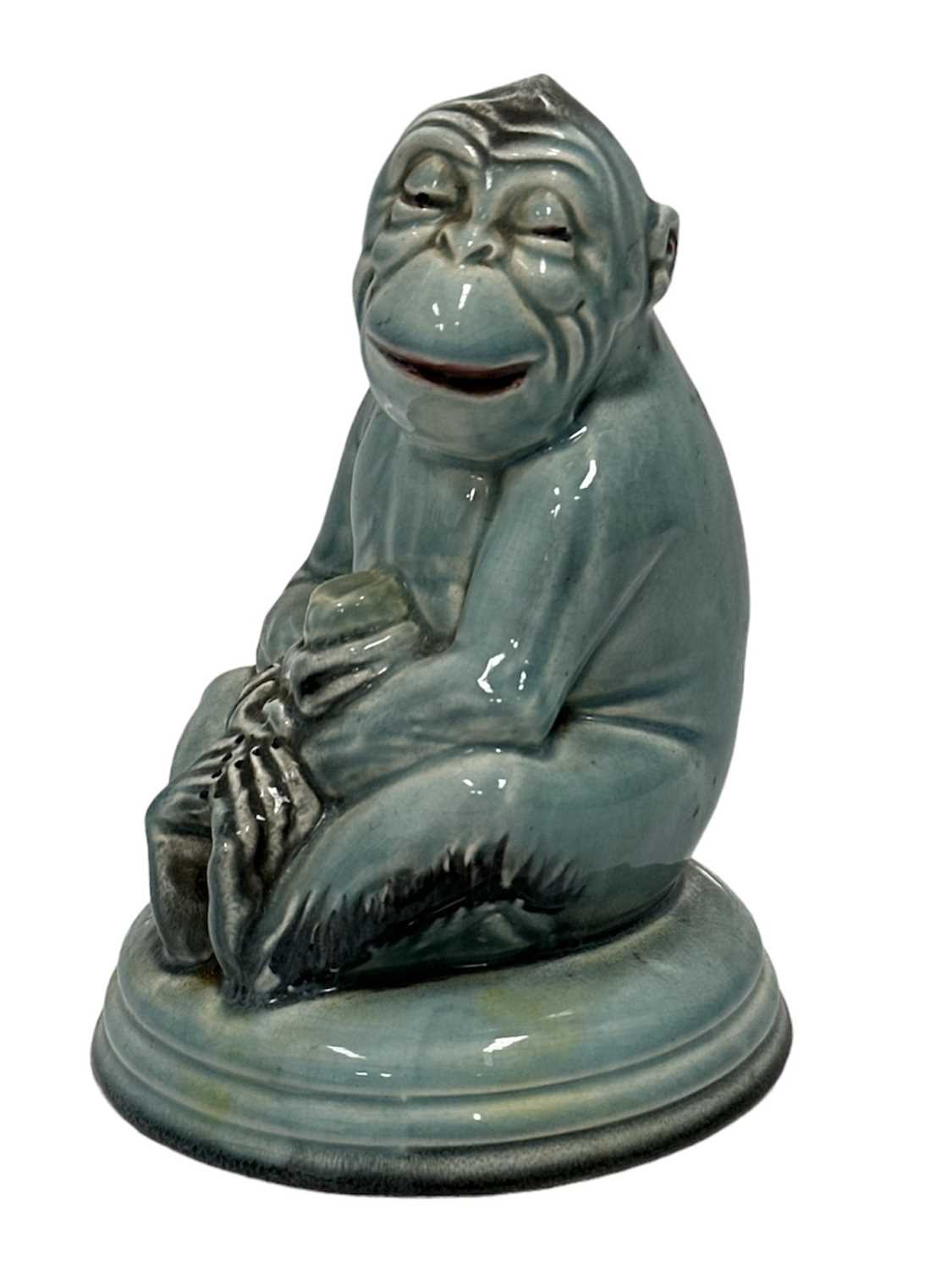 Lot 376 - Beswick an early blue-glazed monkey on a