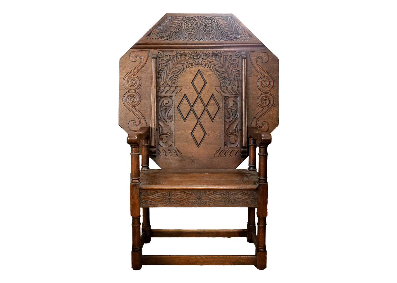 Lot 294 - A 17th century style carved oak monks seat.