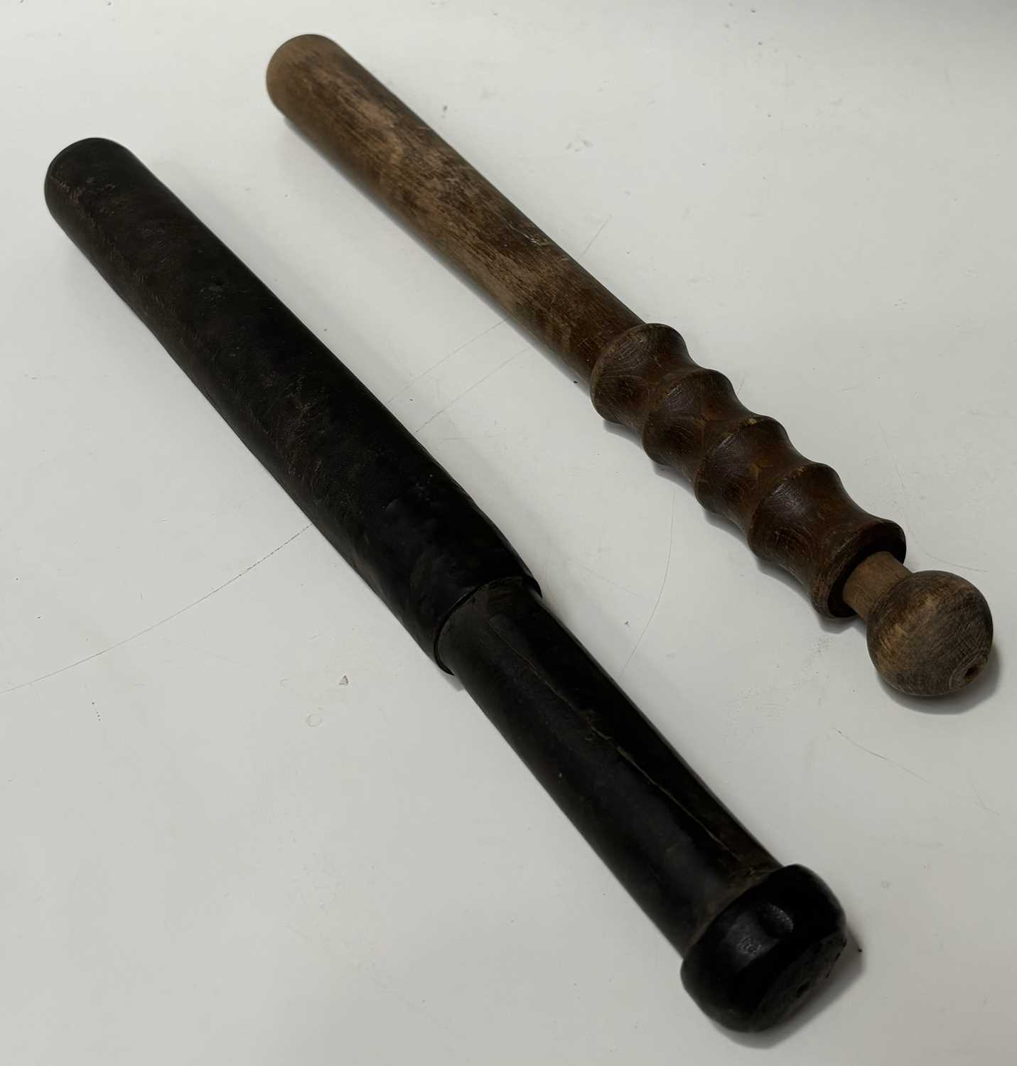 Lot 69 - Two truncheons, one is wooden and stamped