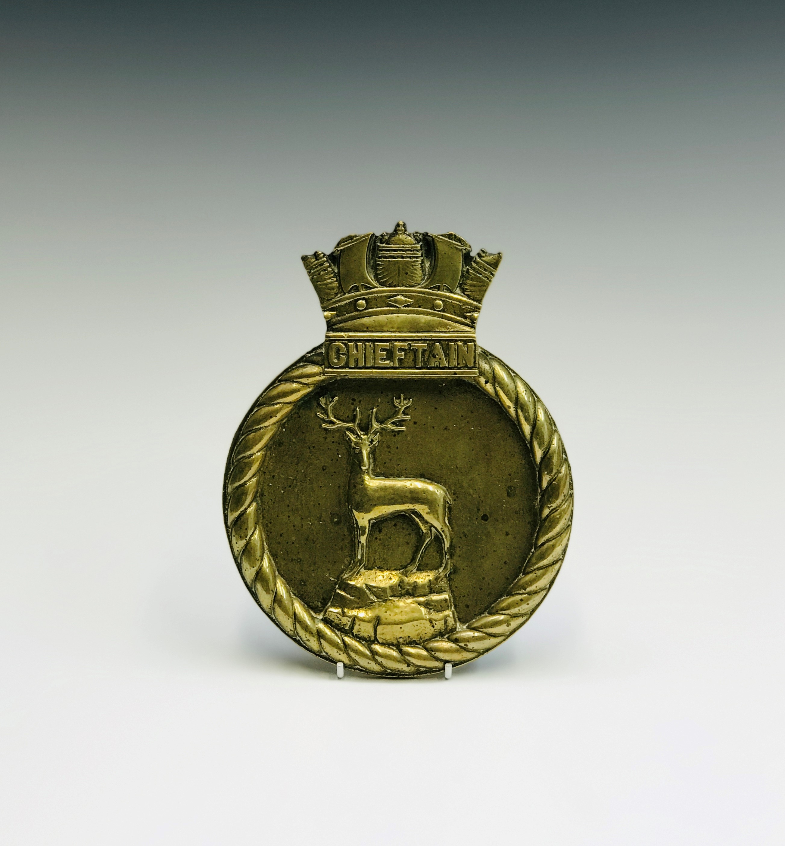 Lot 124 - A brass ship's badge - HMS Chieftain. Height
