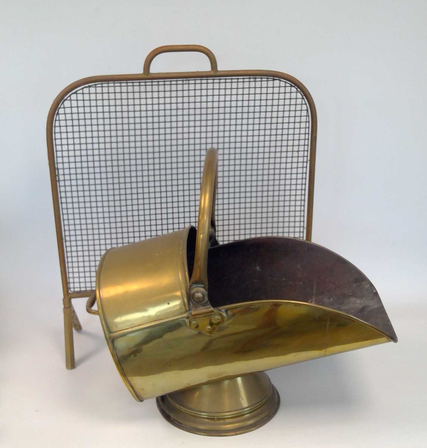 Lot 88 - A brass coal scuttle and brass fire guard,