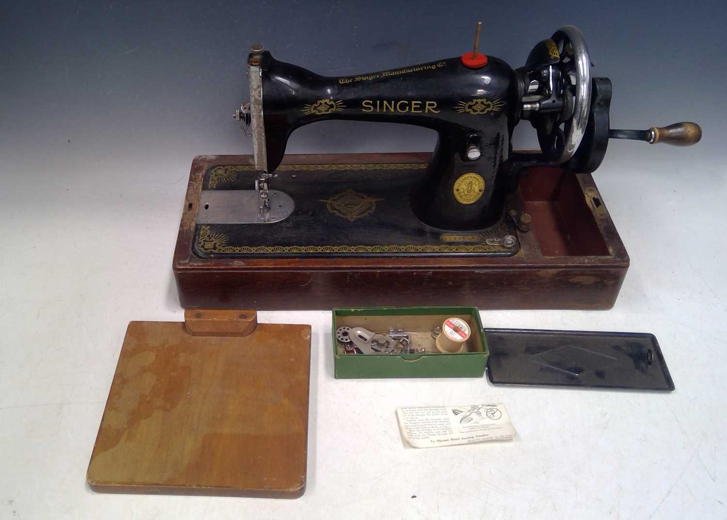 Lot 134 - A Singer Sewing Machine and Accessories.
