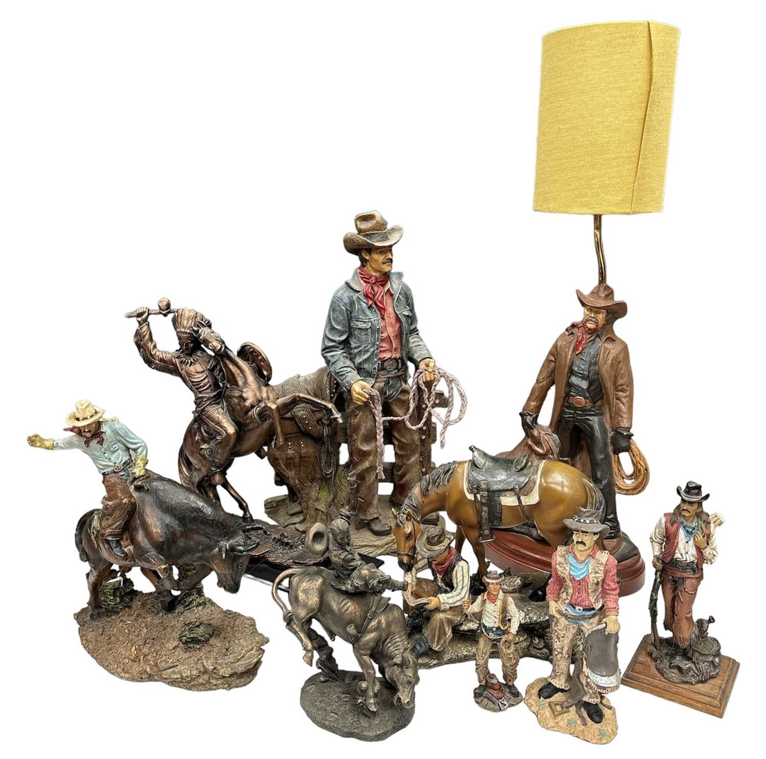 Lot 187 - Cowboy and Native American resin figures,