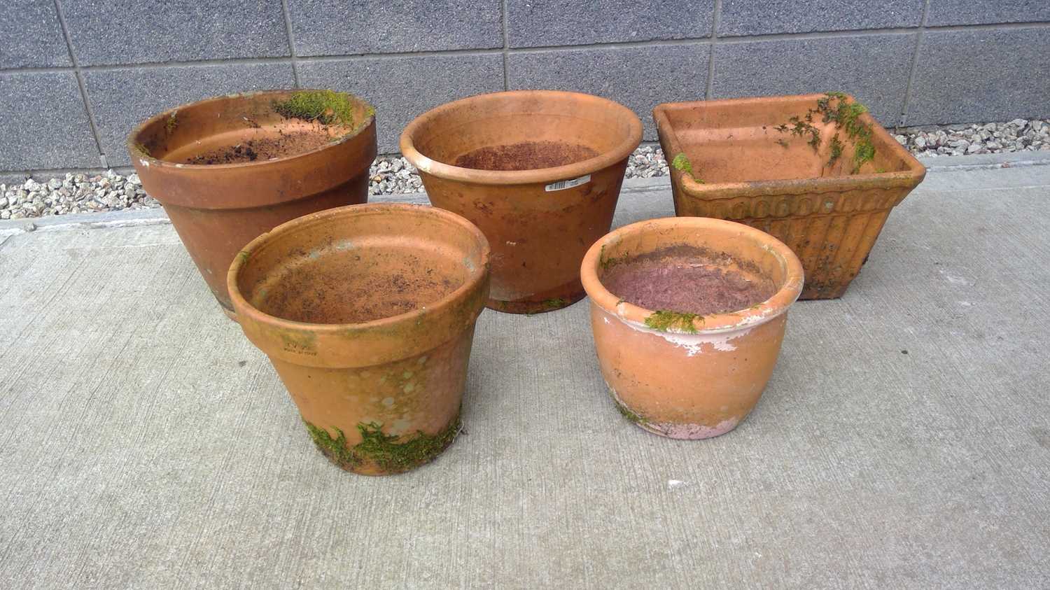 Lot 44 - Five Terracotta Plant Pots. The Largest