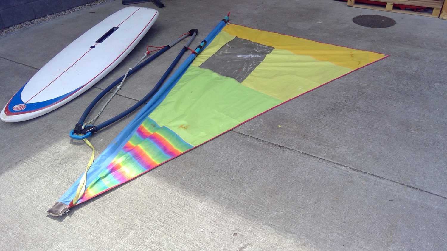 Lot 49 - An incomplete, Wind Surf Board and Sail.
