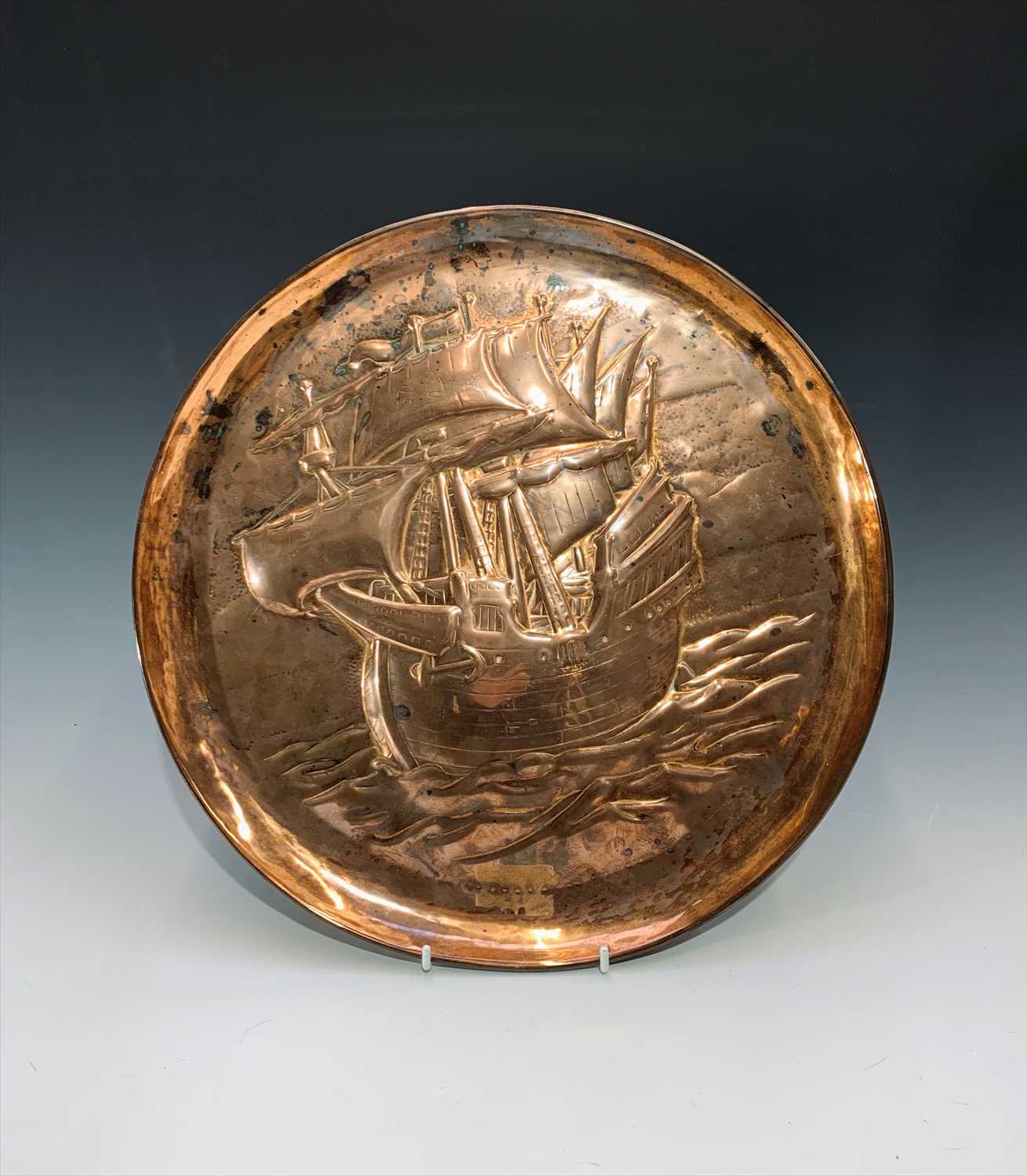 Lot 260 - A Newlyn copper charger of circular form,